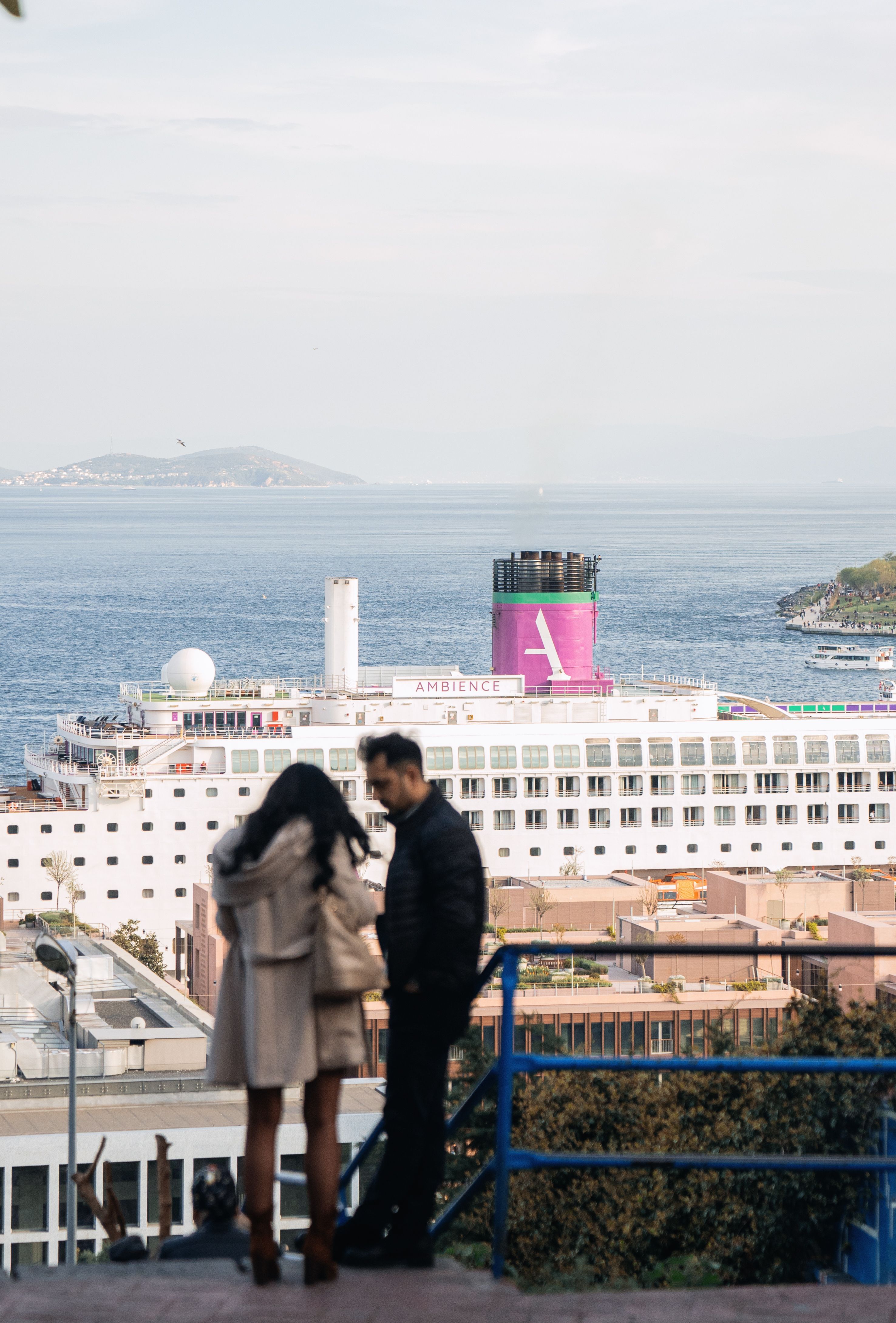 Couple Standing at a Waterfront, and a Ferry in Background · Free Stock ...
