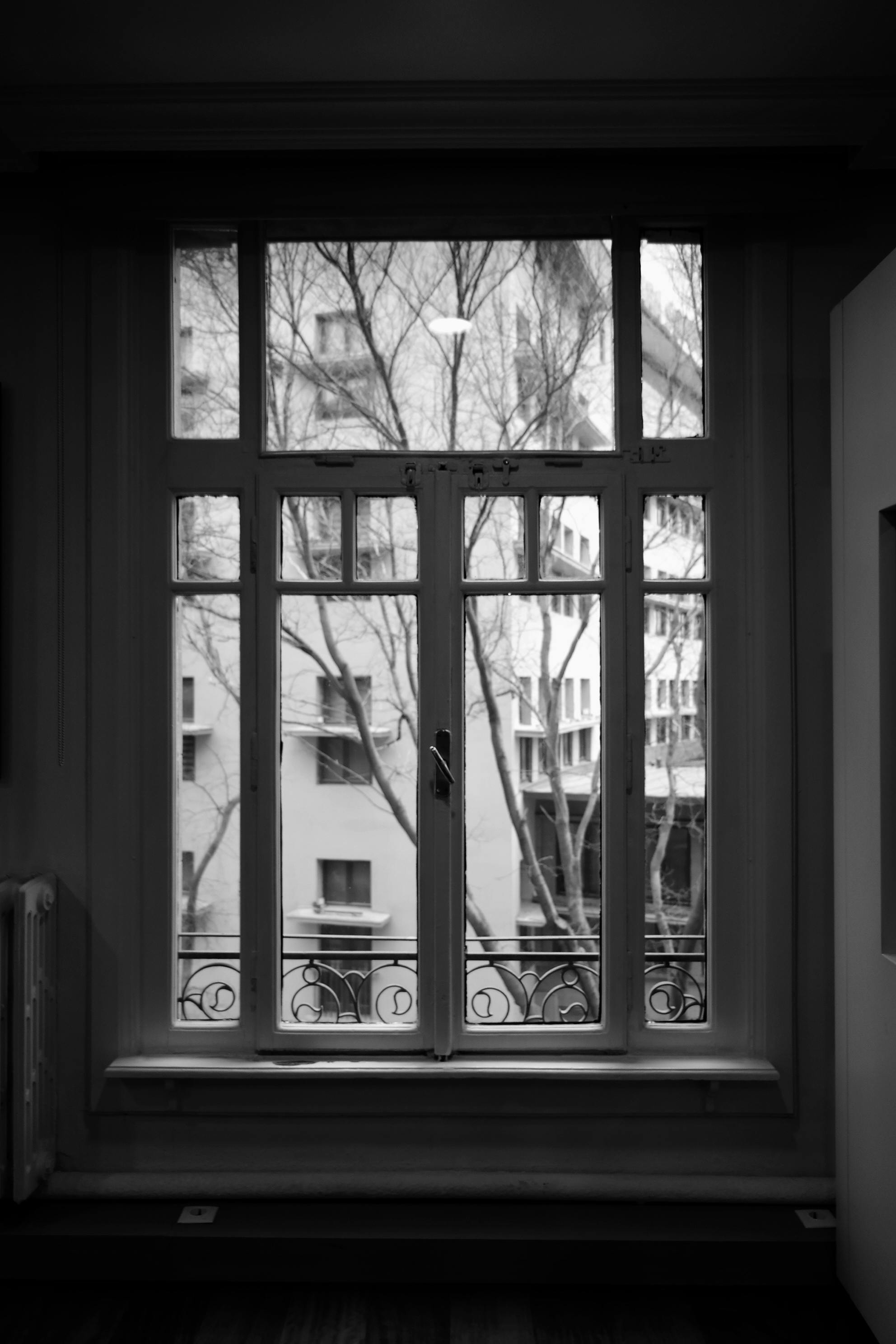 Black and White Picture of a Window with a Wooden Frame · Free Stock Photo