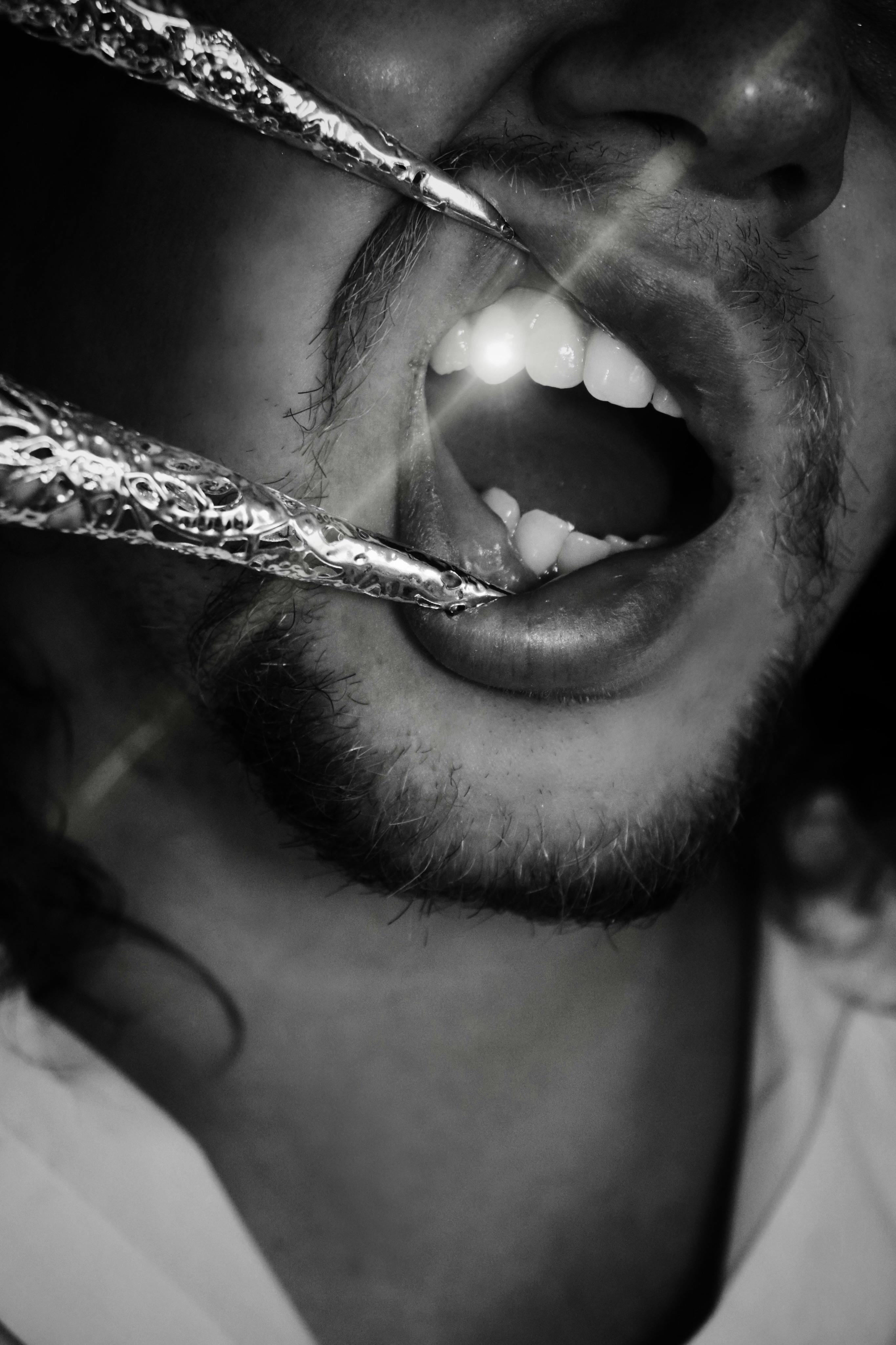 Close up of Shiny Man Teeth · Free Stock Photo