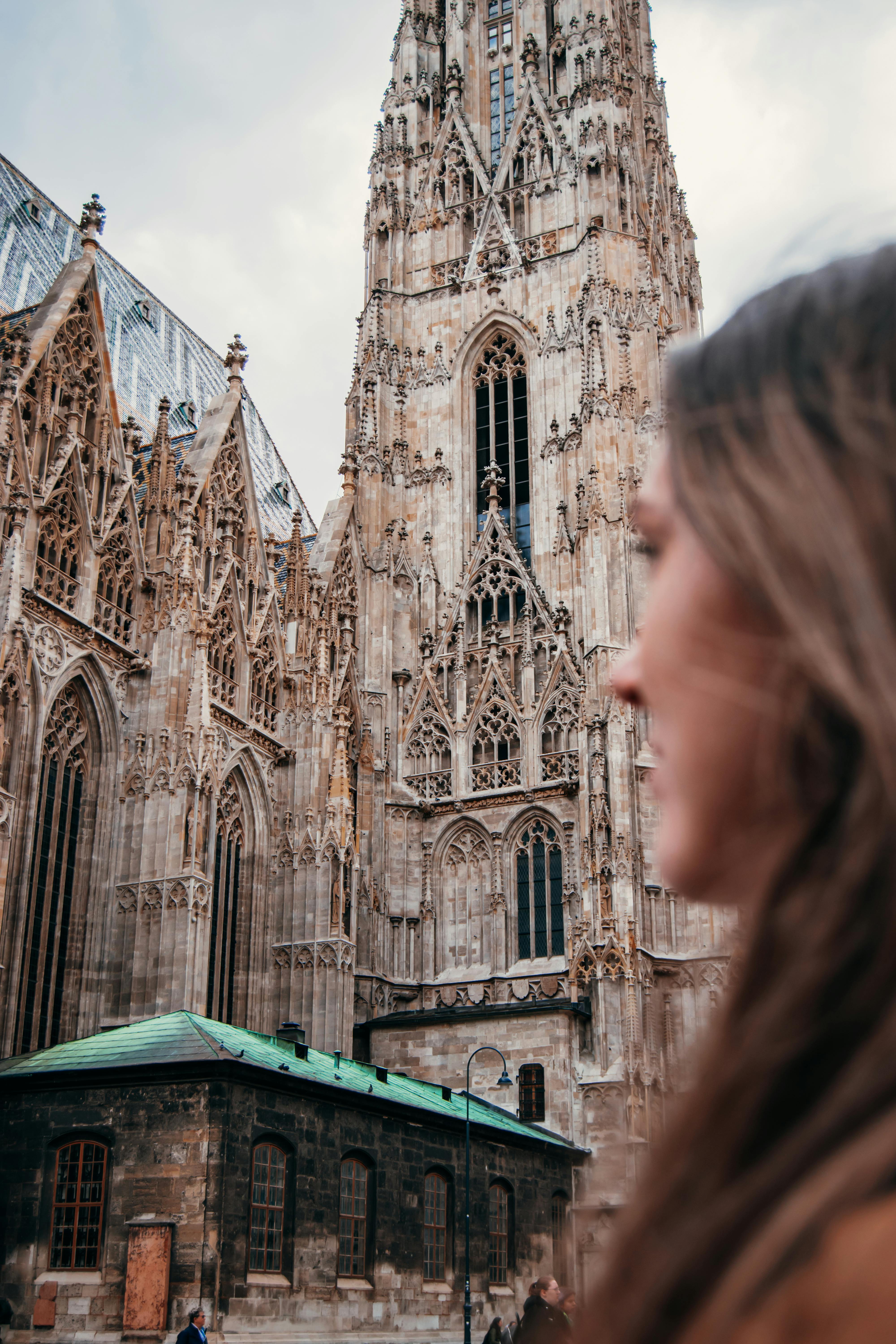 Woman Face and Vienna Cathedral behind · Free Stock Photo