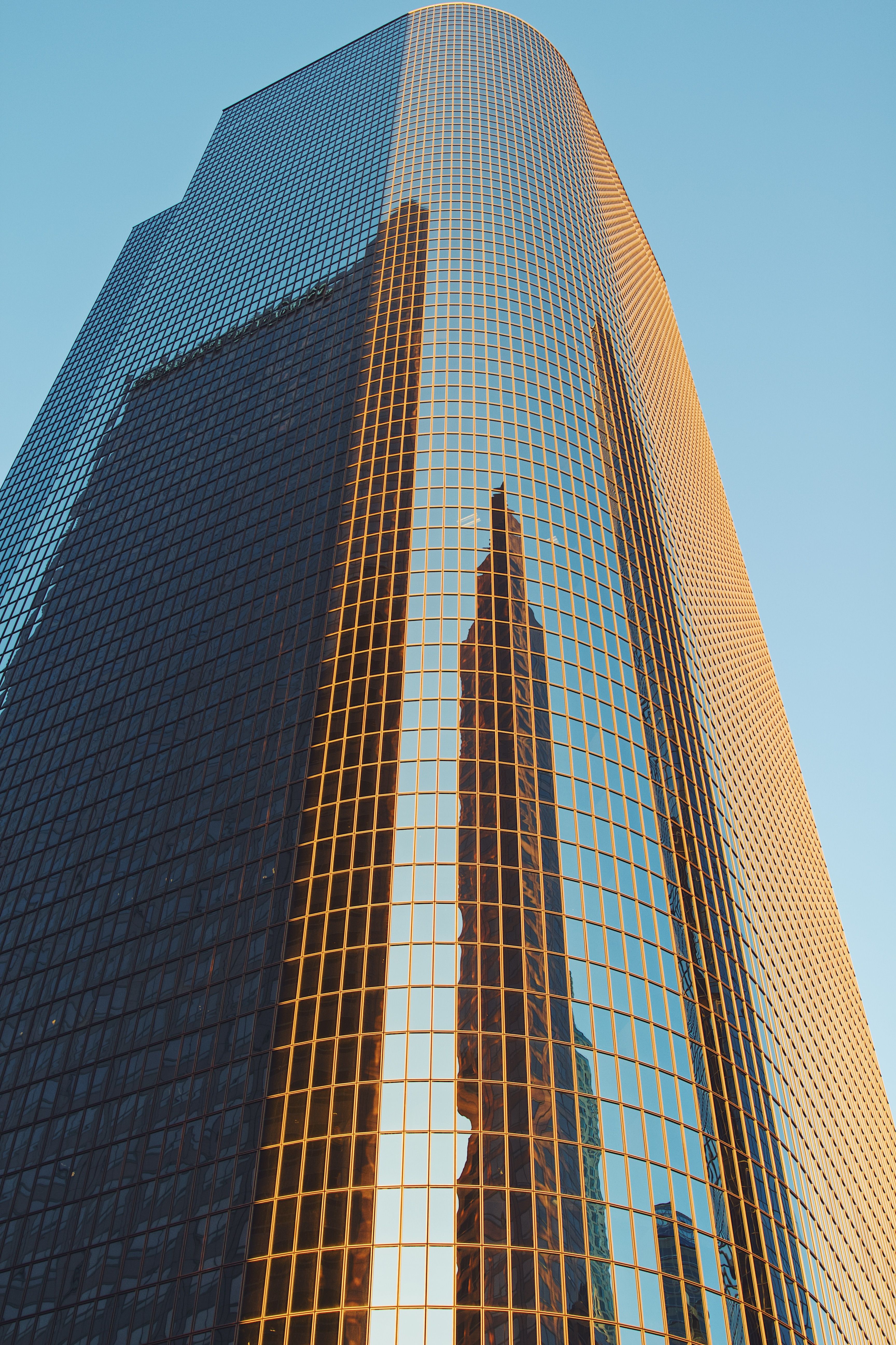 Modern Glass Skyscraper against Blue Sky · Free Stock Photo