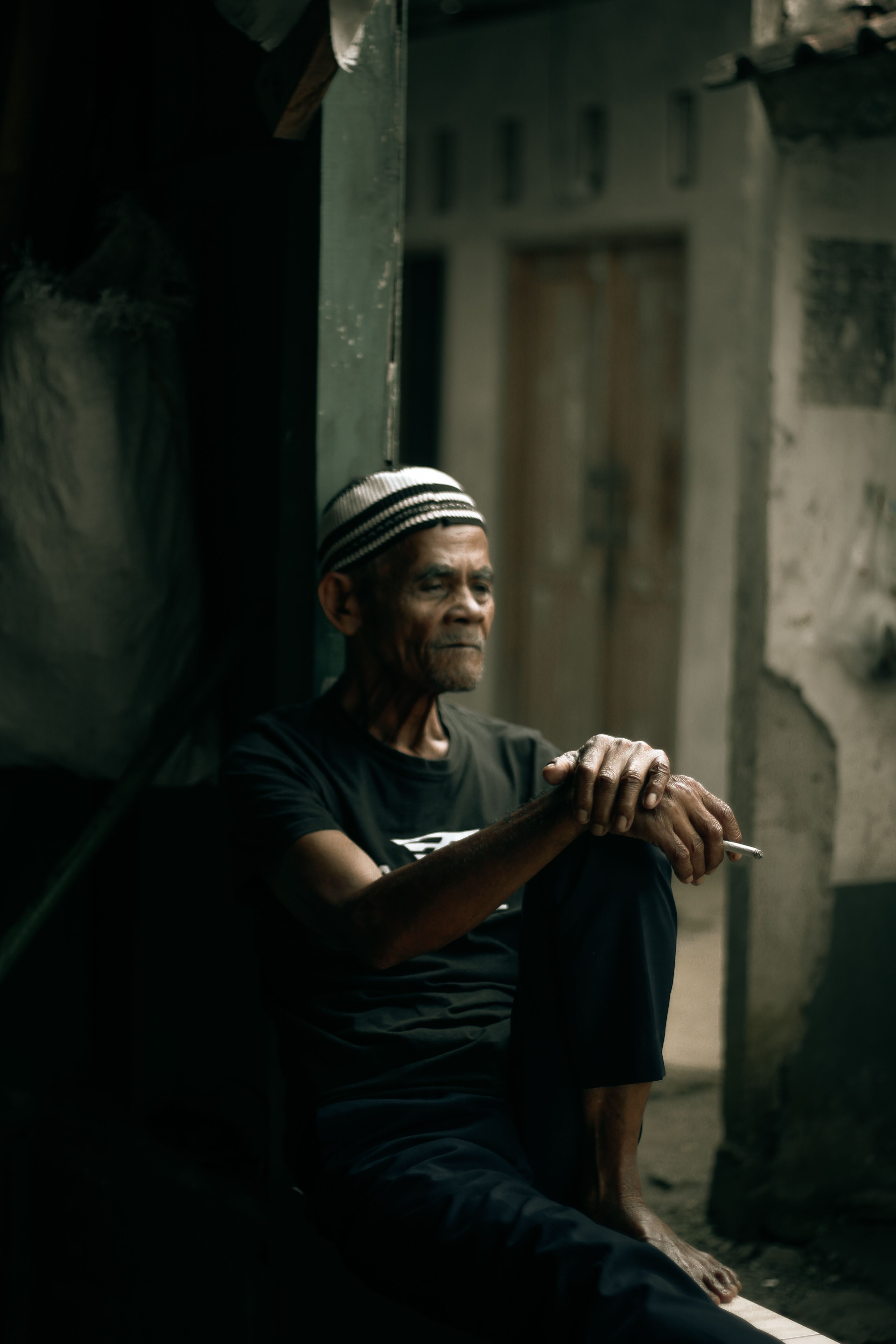 Old Man in Turban Smoking Cigarette in Abandoned Building · Free Stock ...
