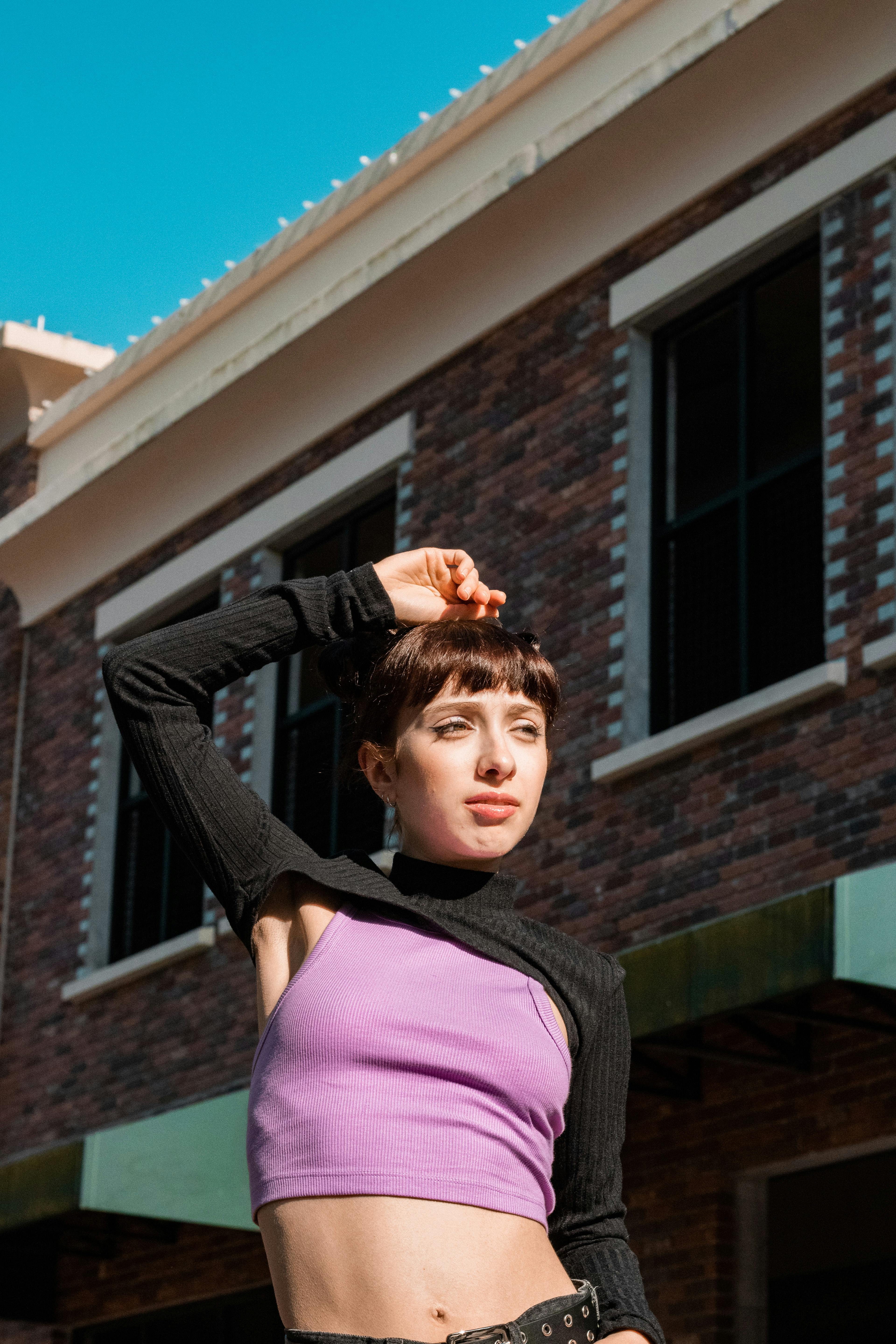 Woman Posing in Violet Tank Top · Free Stock Photo