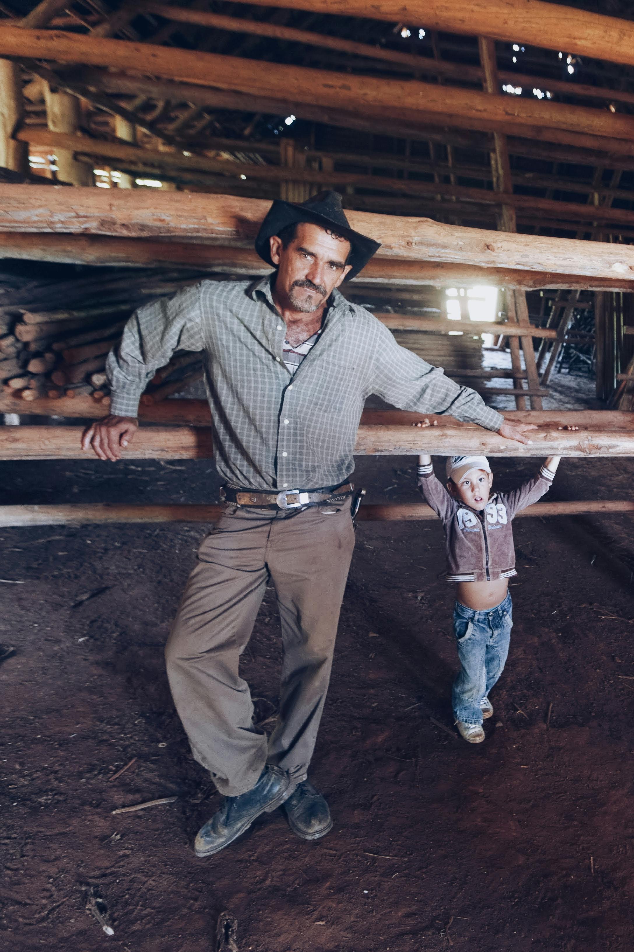 Cowboy Posing with Son · Free Stock Photo