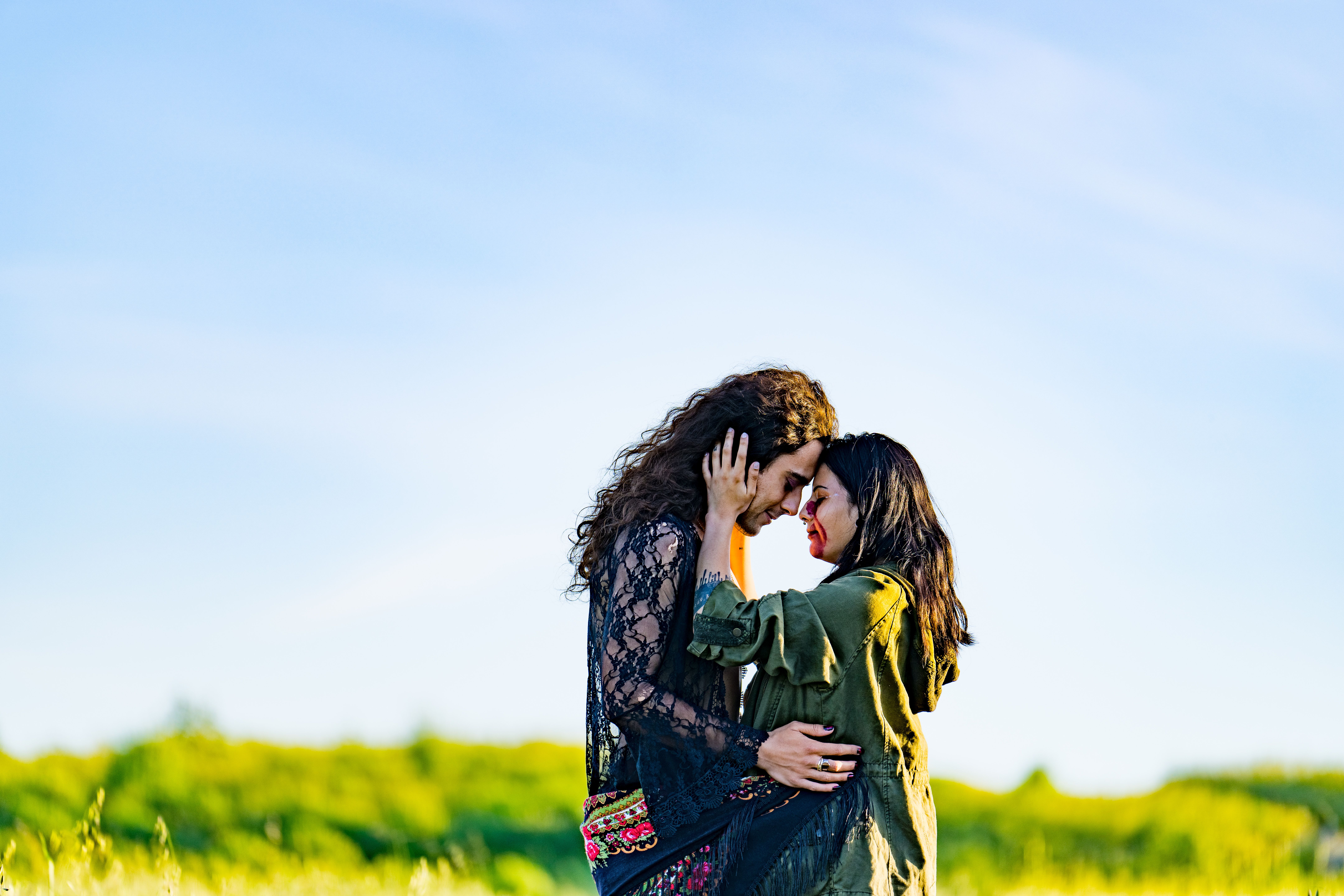 Young Couple Hugging in Summer Field · Free Stock Photo