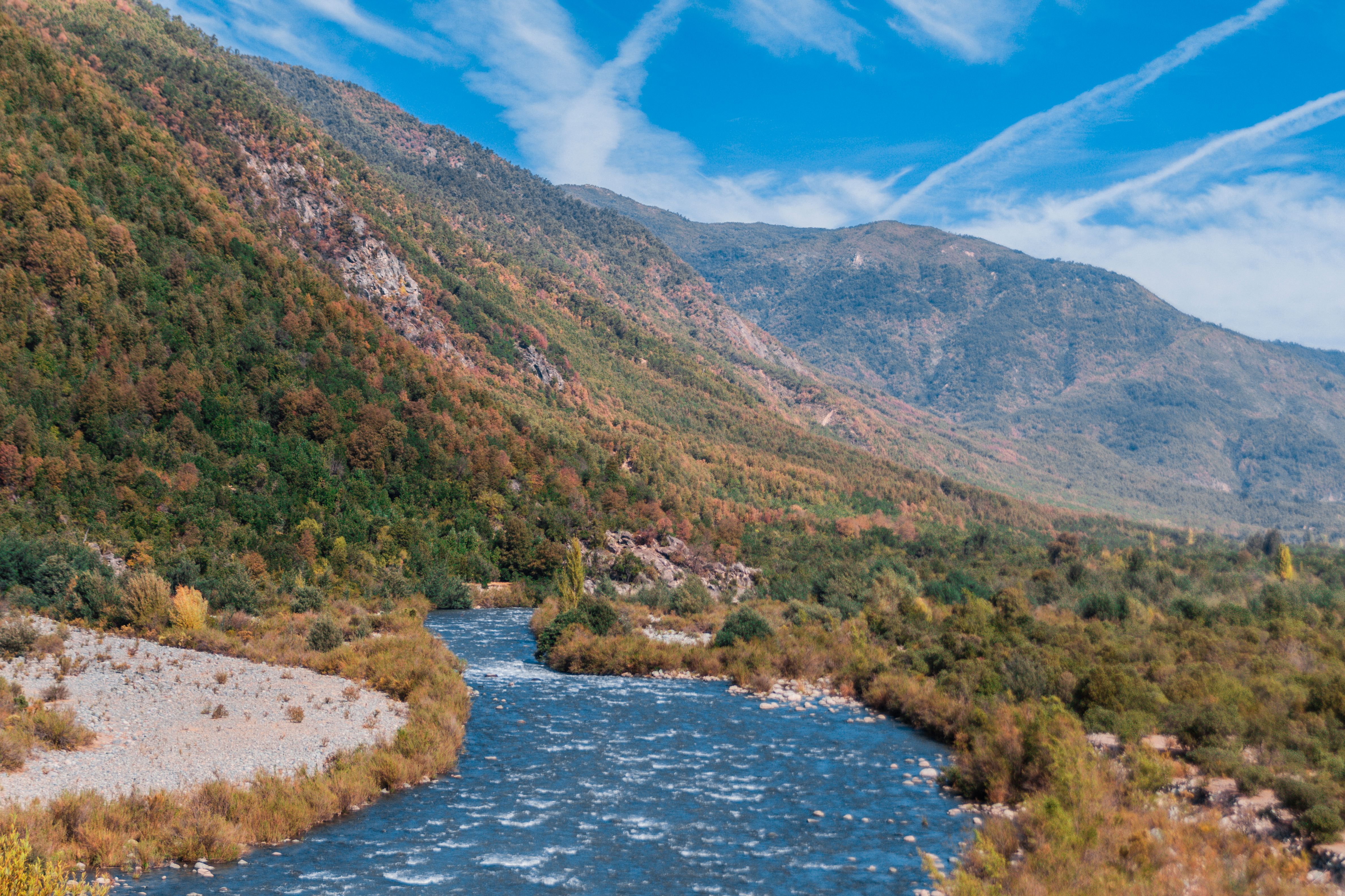 River under Hill in Countryside · Free Stock Photo