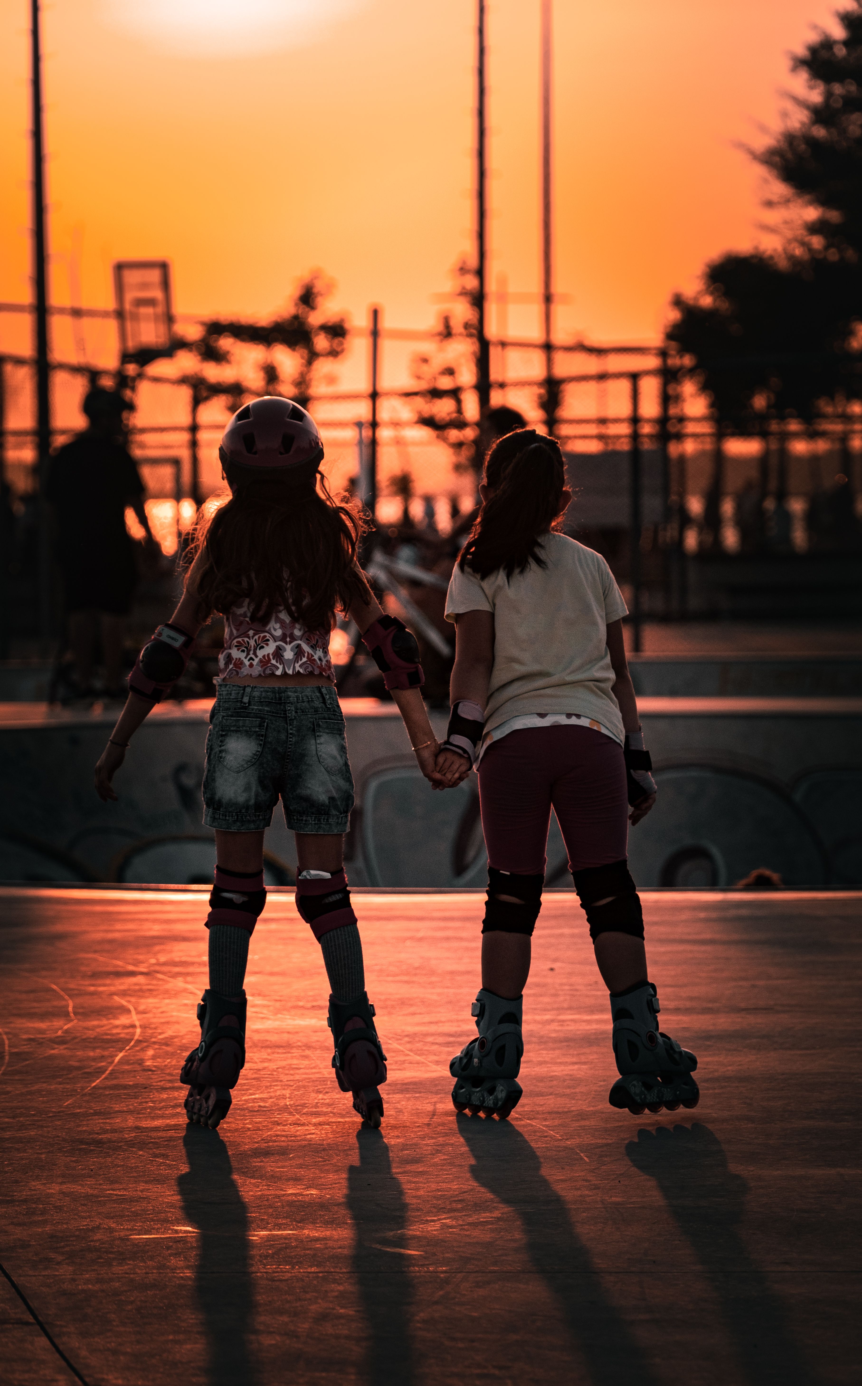 Girls on Roller Skates in Skatepark at Sunset · Free Stock Photo