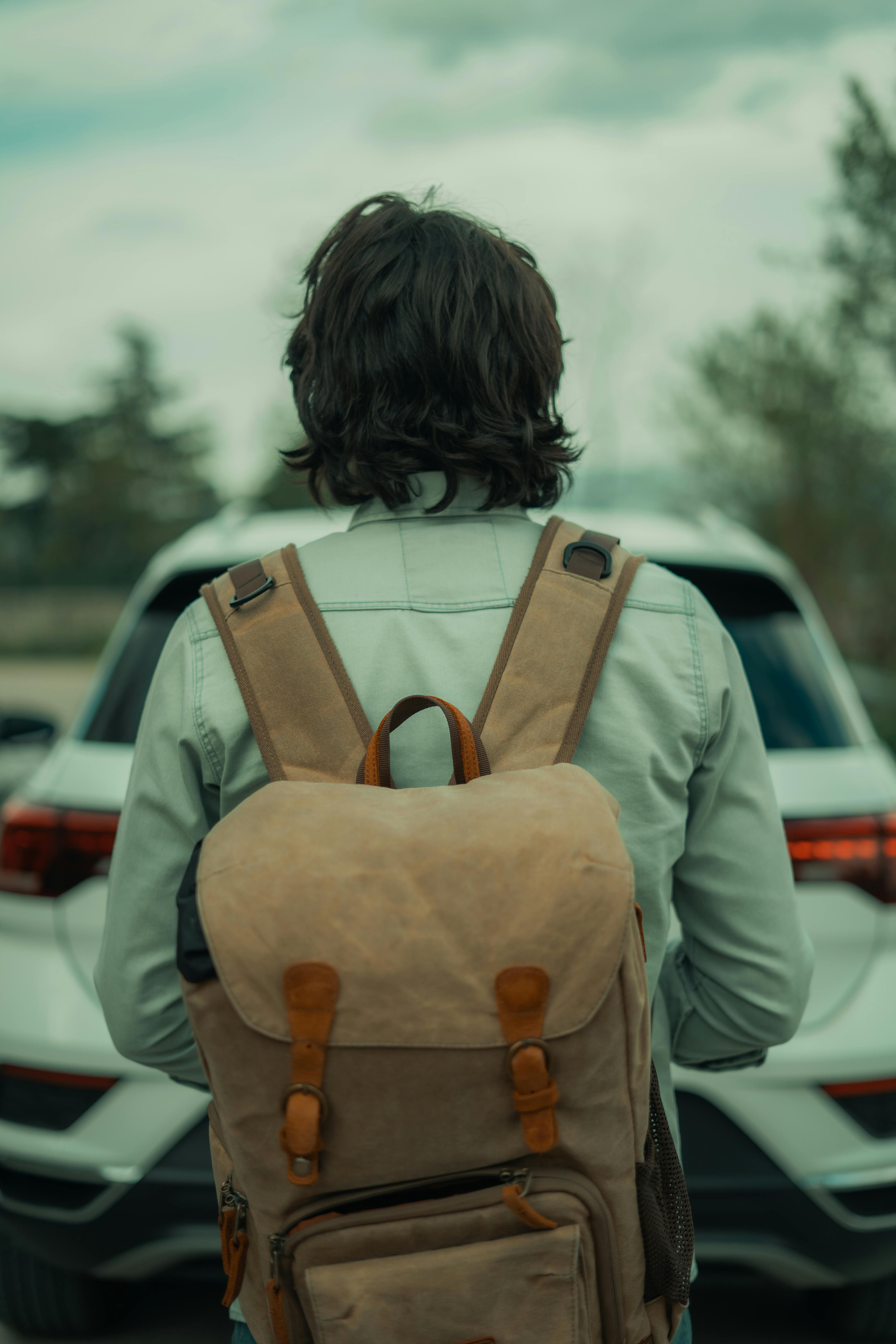 Back View of a Man with a Backpack · Free Stock Photo