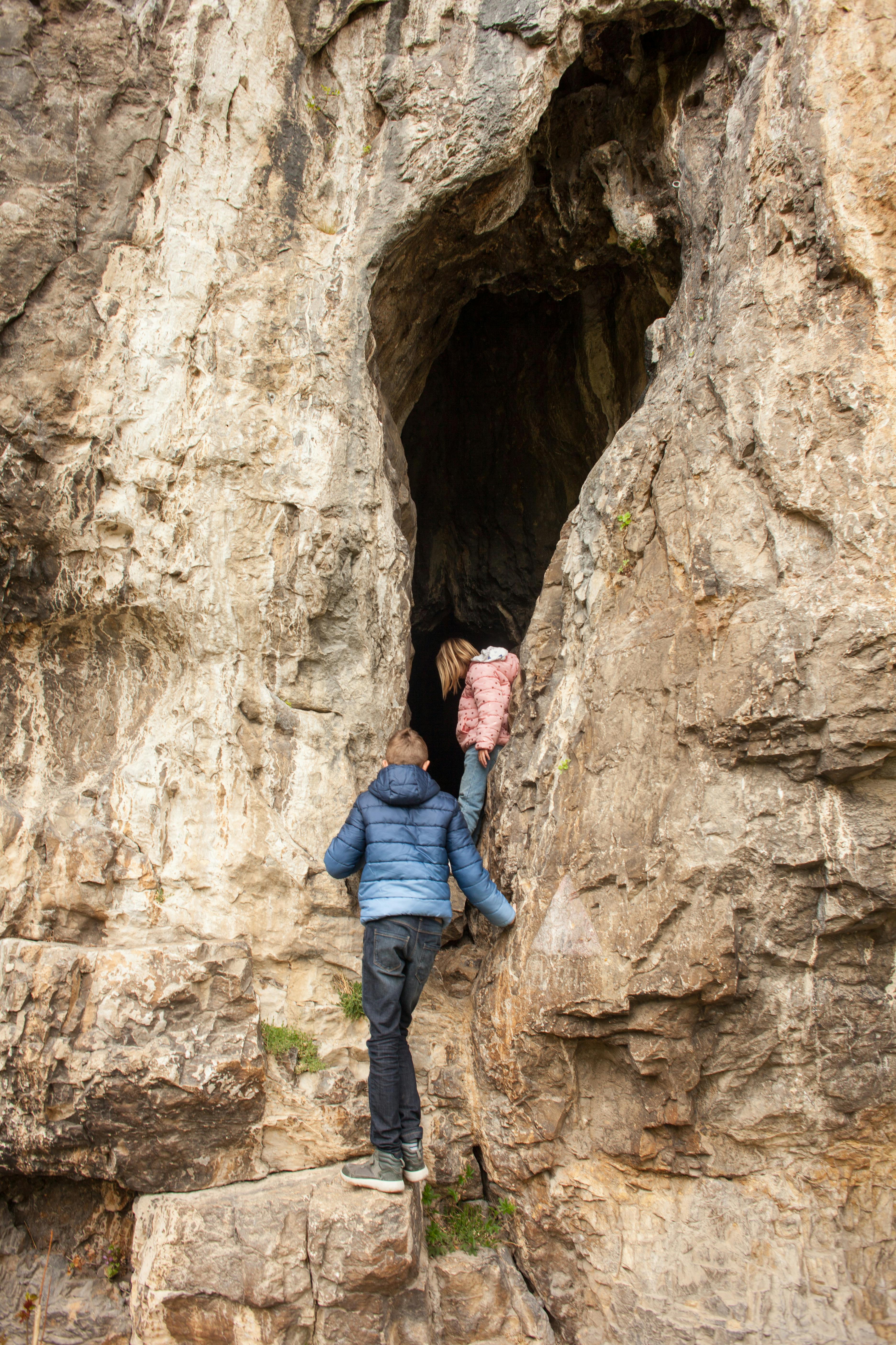 Children by Cave Entrance · Free Stock Photo