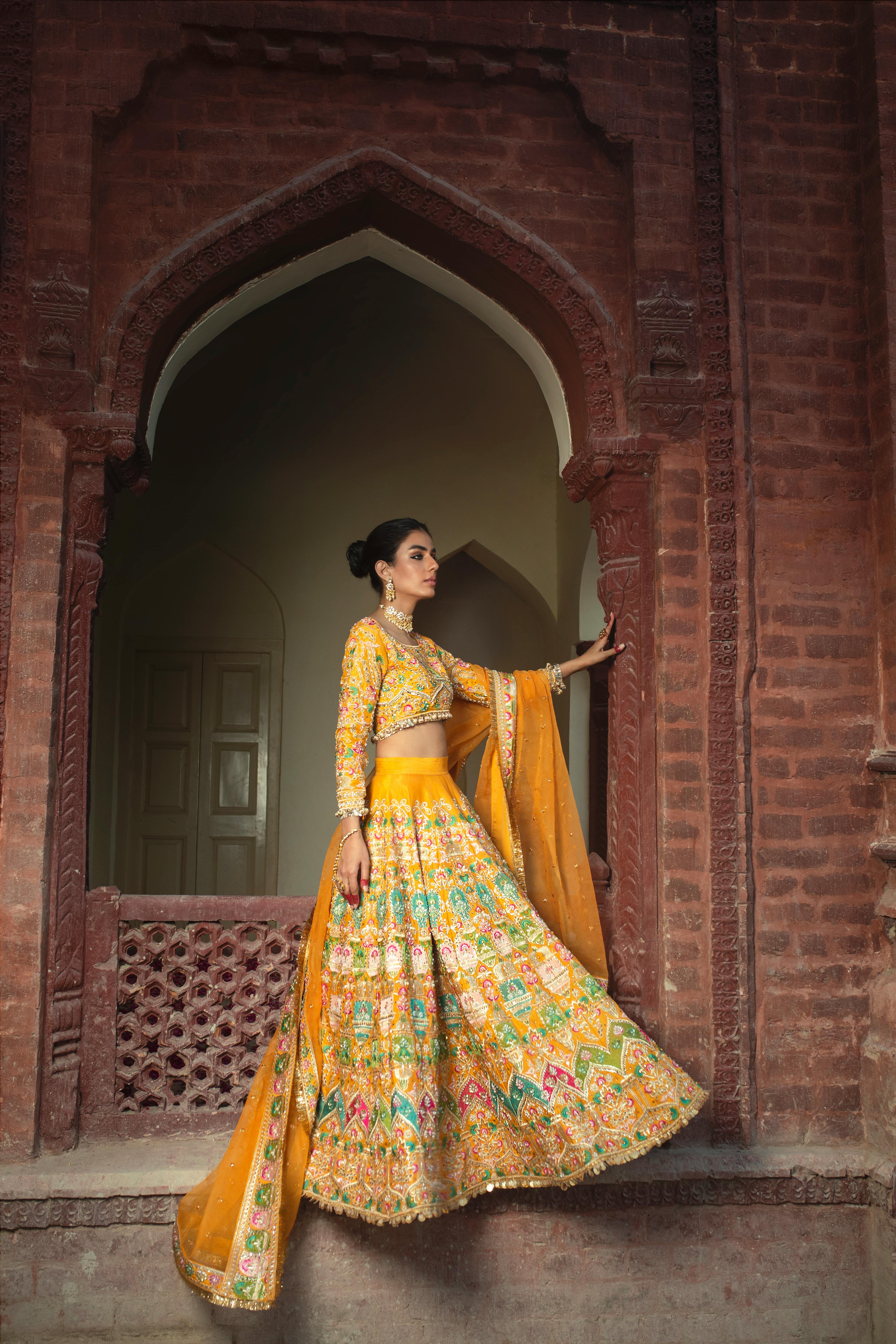 Woman Posing in Traditional, Yellow Clothes · Free Stock Photo