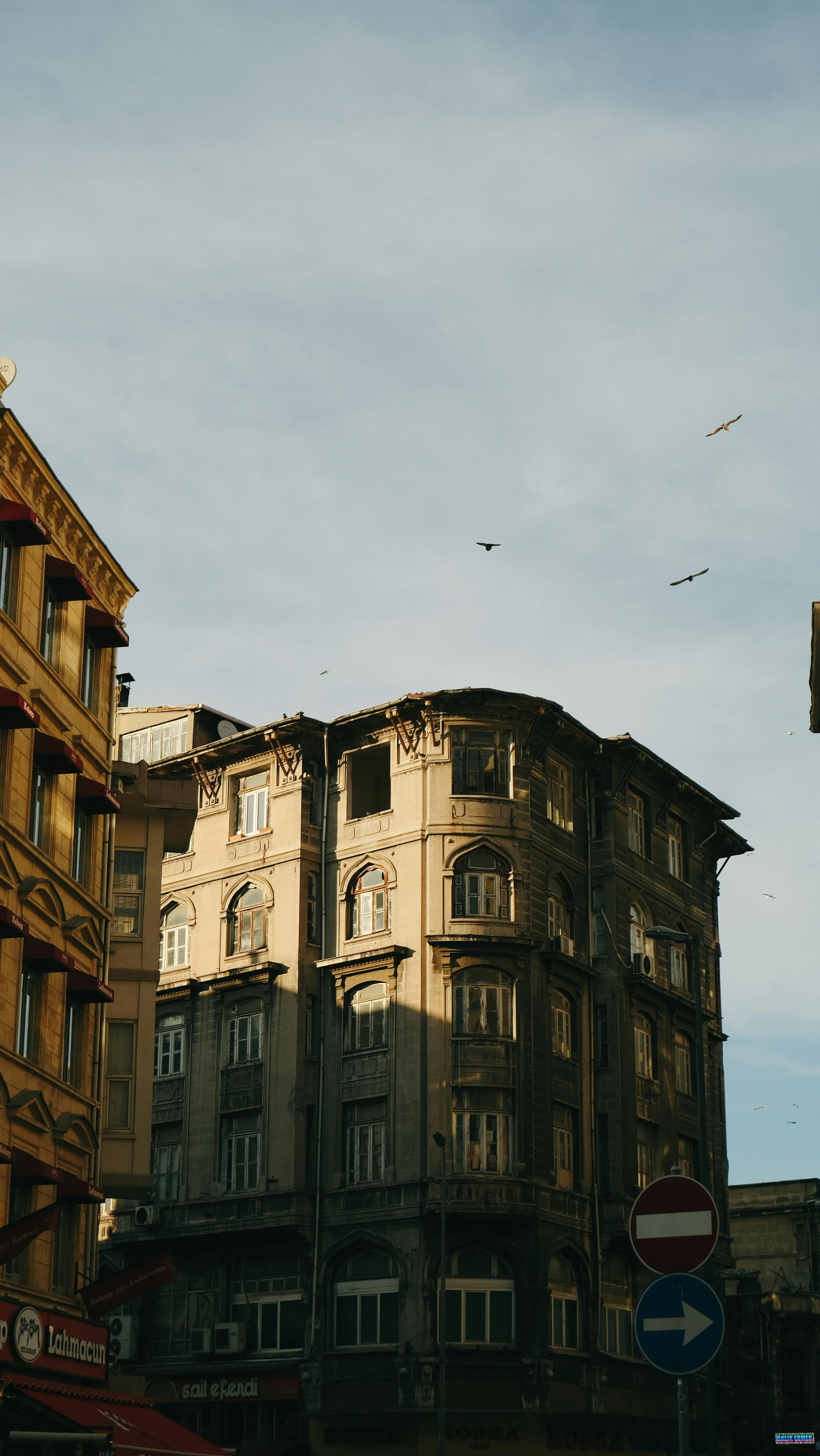 Building behind Road Signs in Town · Free Stock Photo