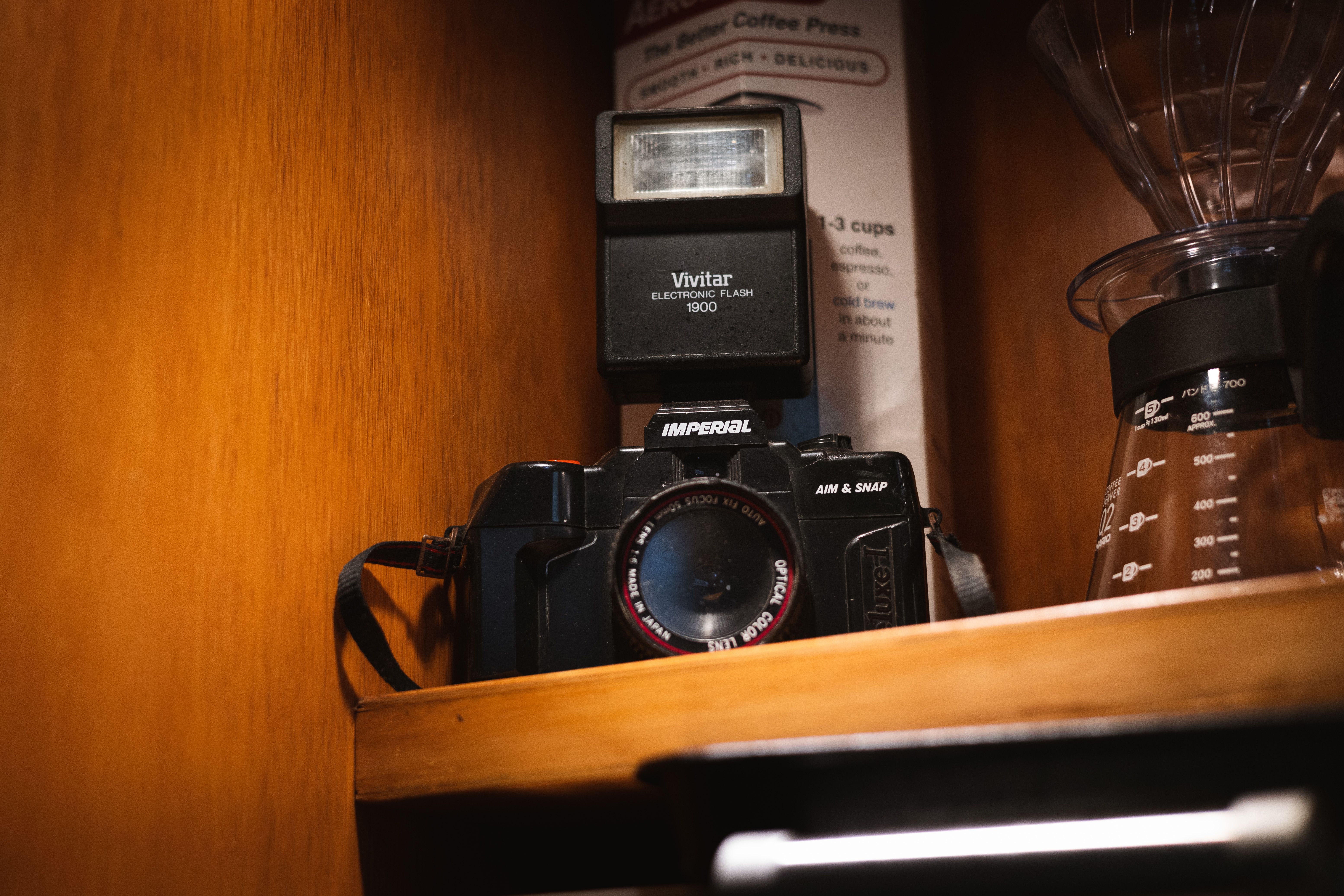 Close-up of a Vintage Camera with a Flash Standing on a Shelf · Free ...