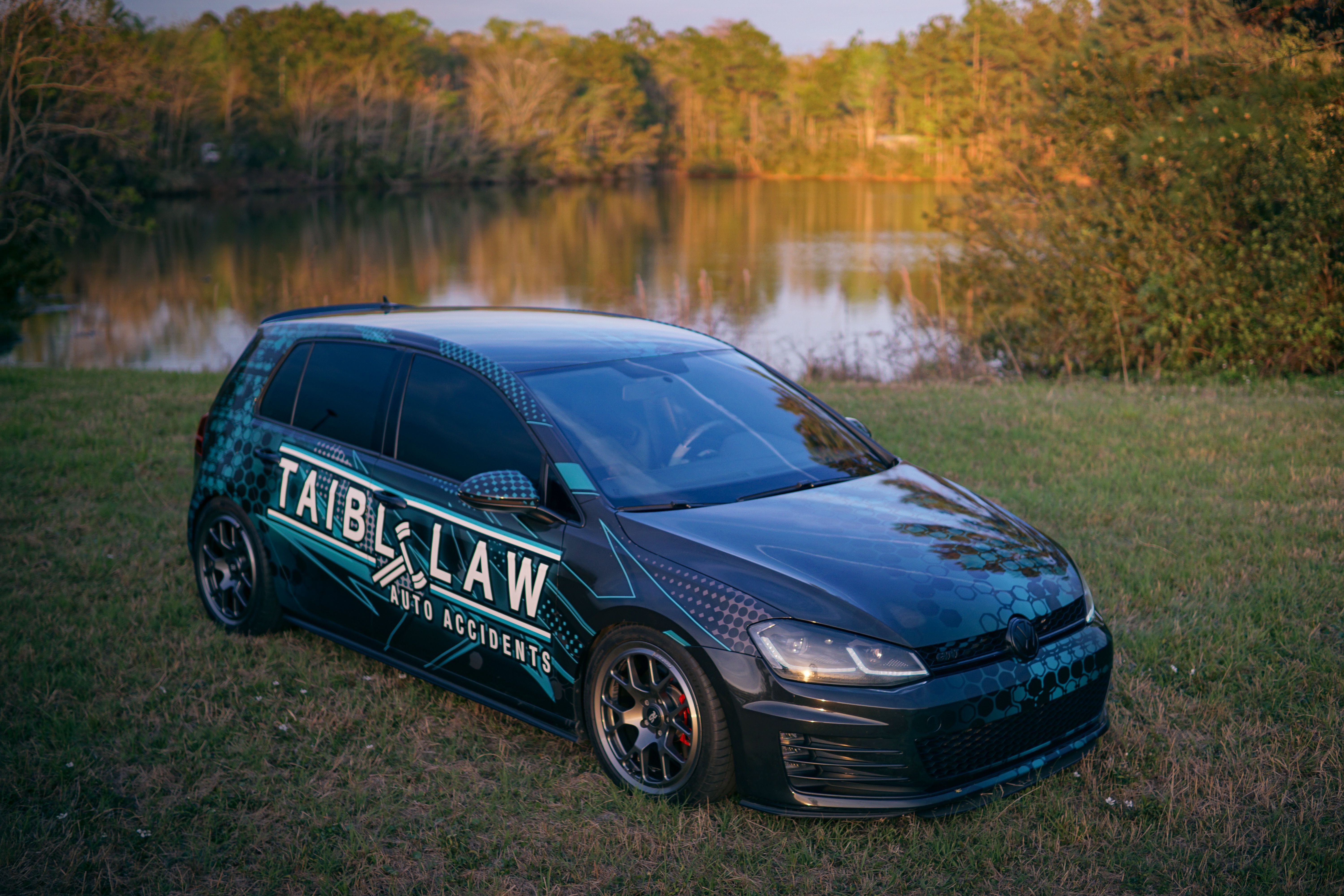 Tuned Volkswagen Golf on Lakeshore · Free Stock Photo