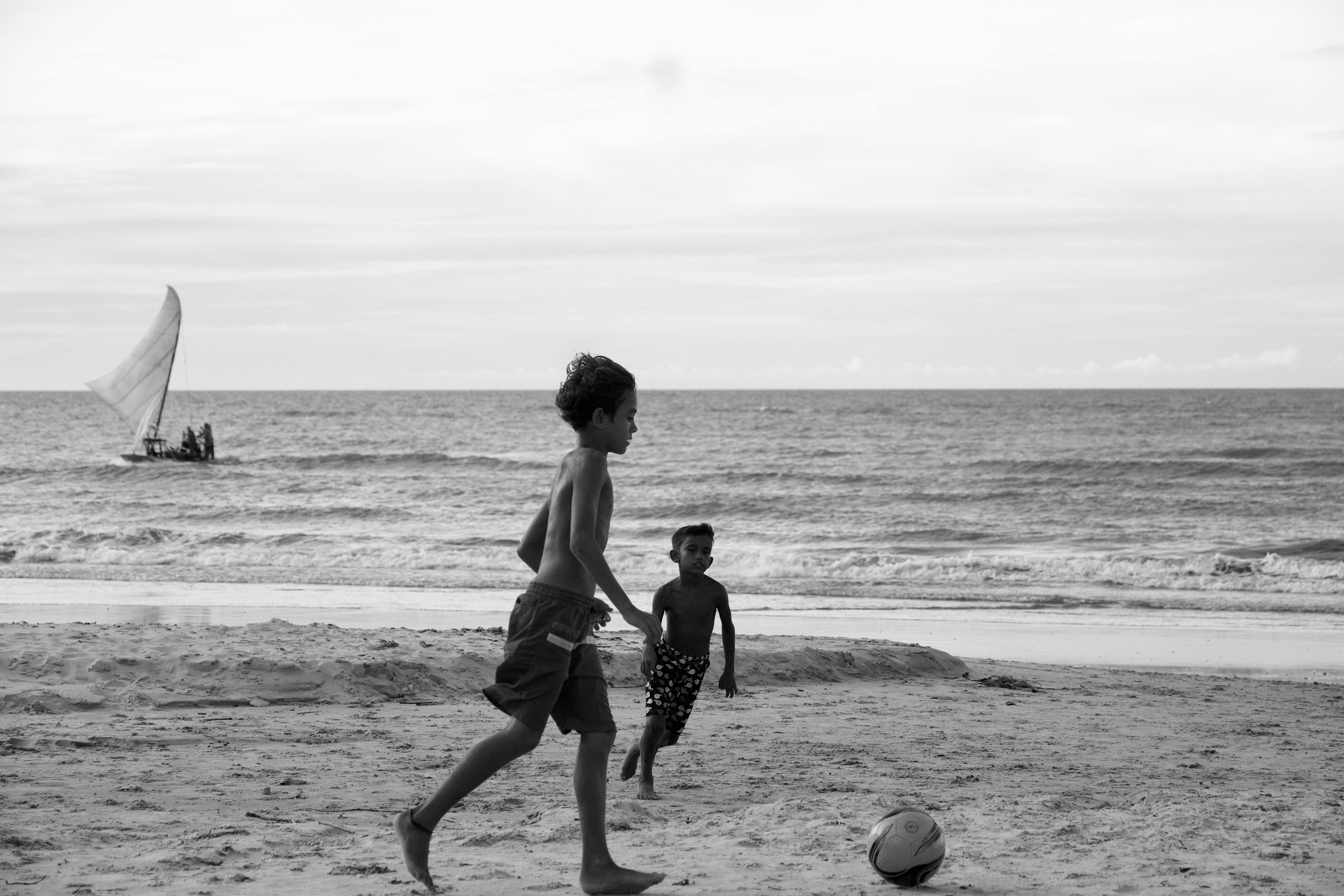 Boys Playing Ball on Beach · Free Stock Photo