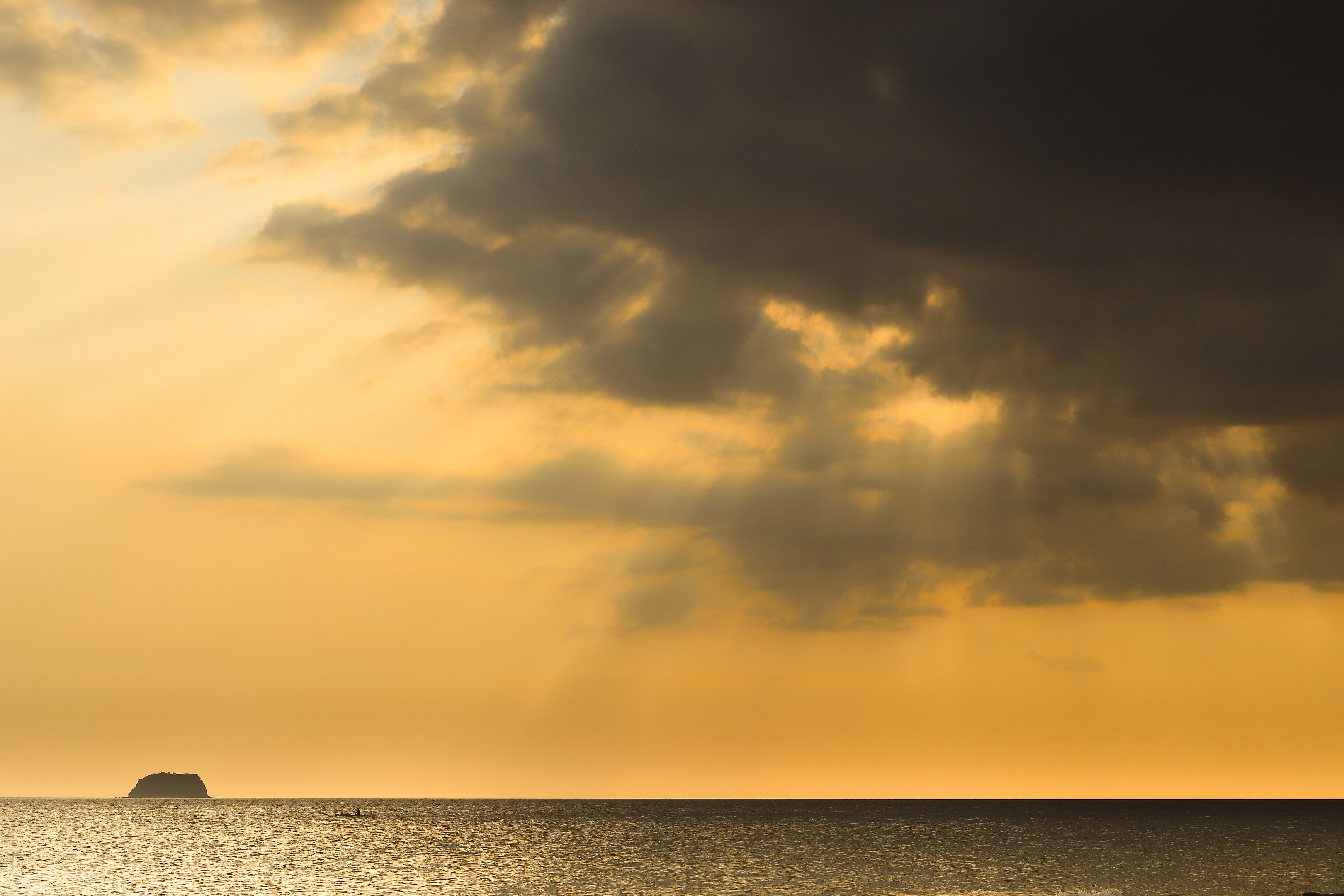 Rain Cloud over Sea on Yellow Sky · Free Stock Photo