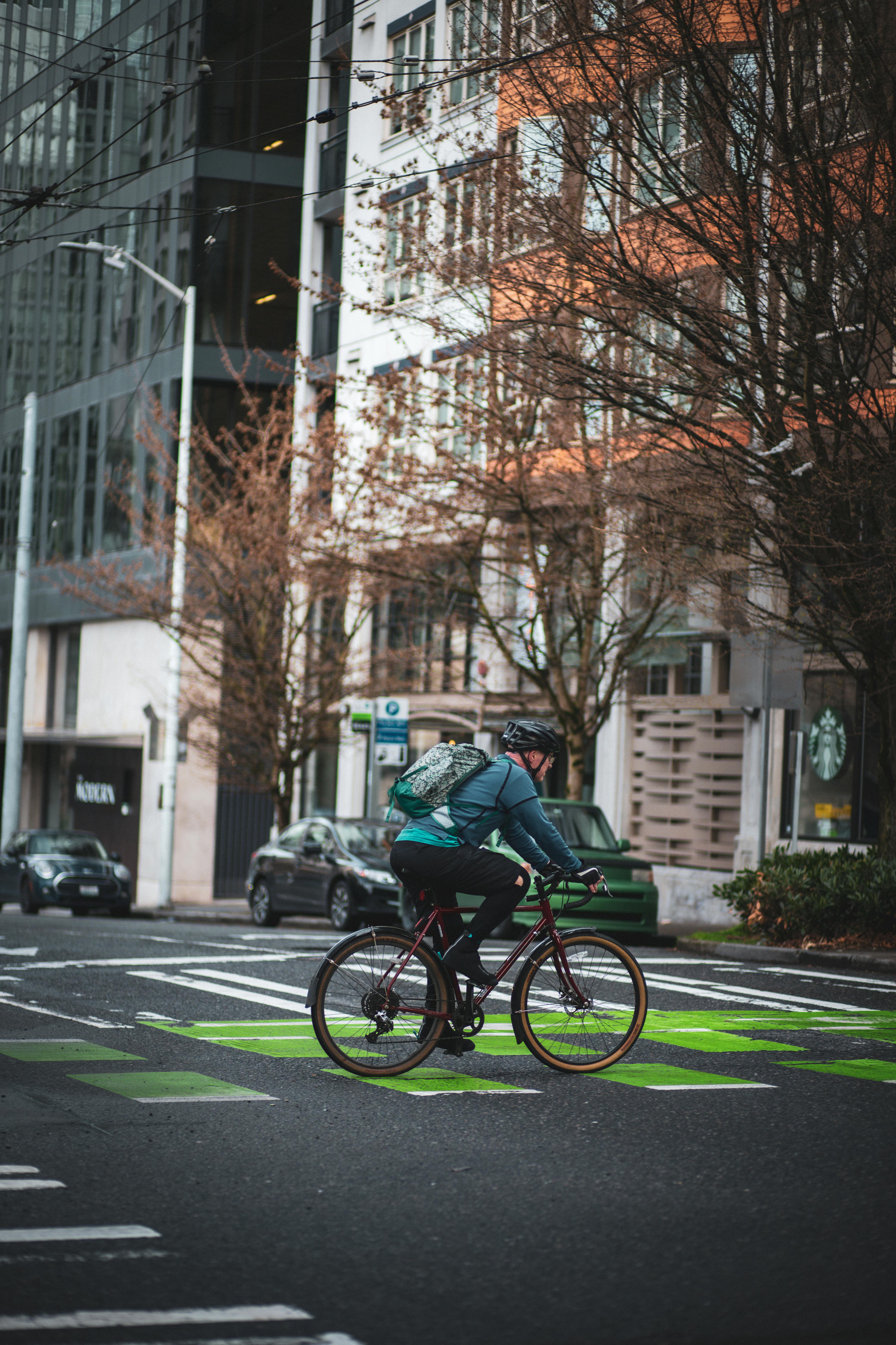 Man on Road Bike Crossing Street · Free Stock Photo