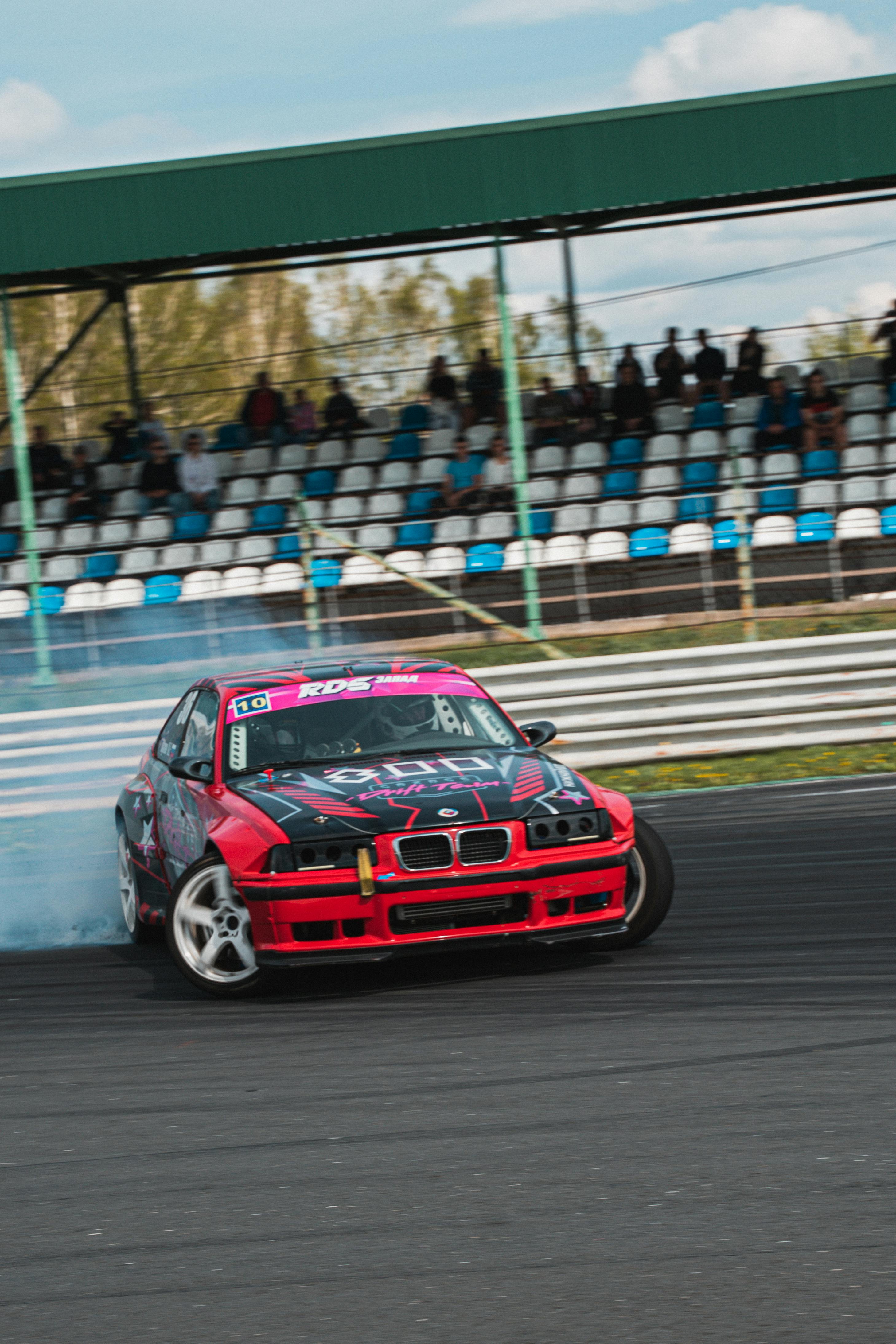 Red Sports Car Racing on the Race Course · Free Stock Photo