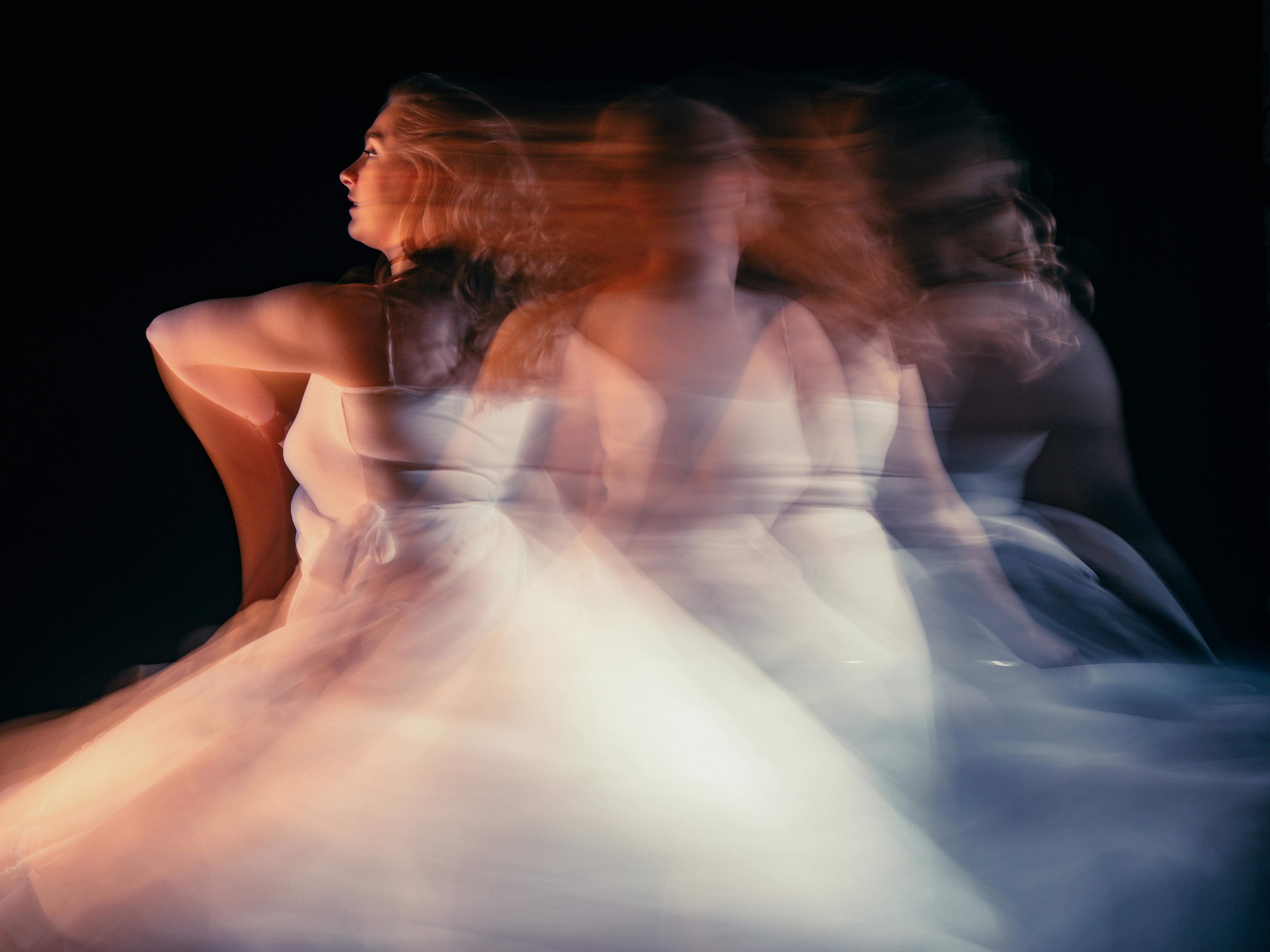 Blurred Woman Dancing in Wedding Dress · Free Stock Photo