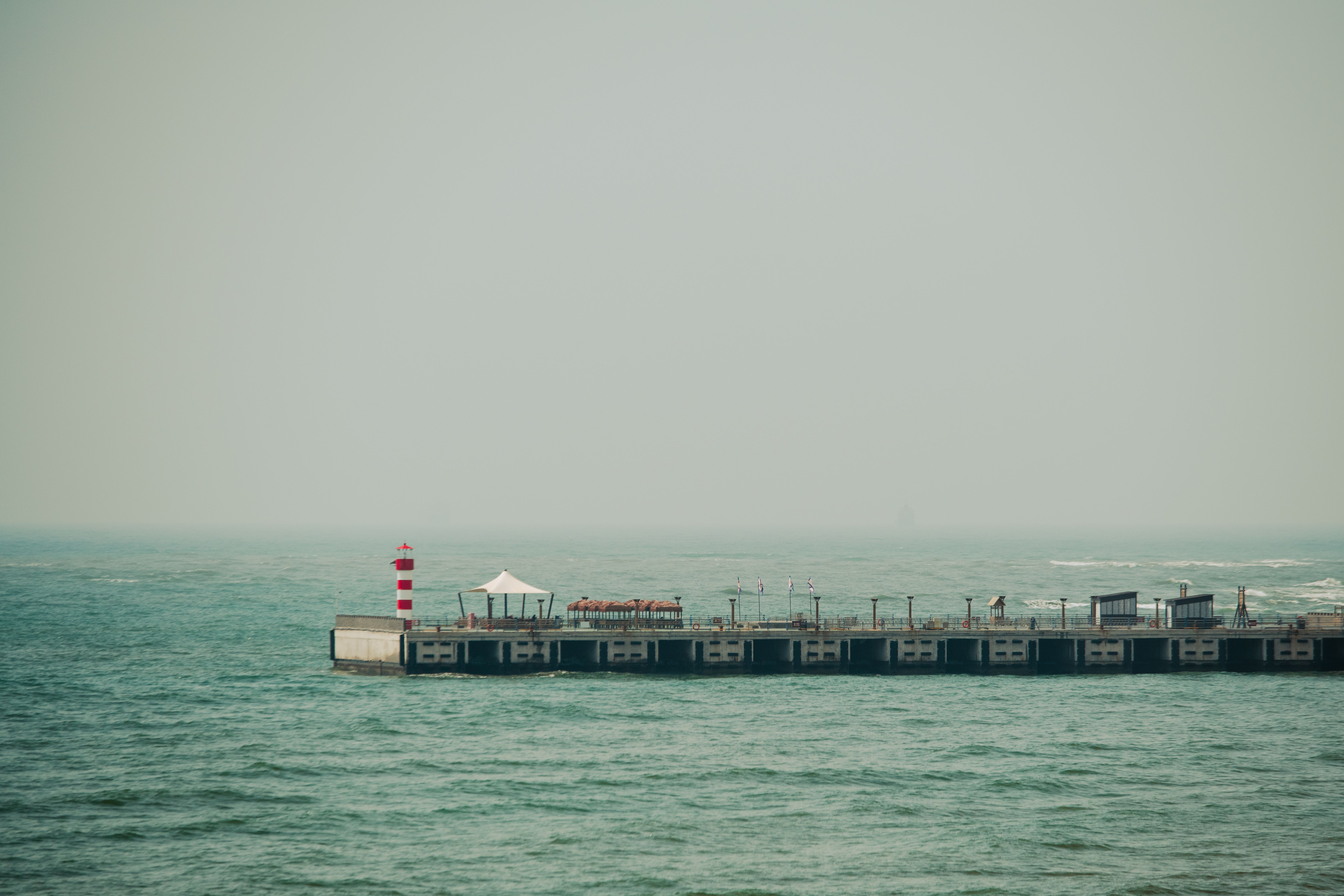 Wooden House on Pier on Sea Shore · Free Stock Photo
