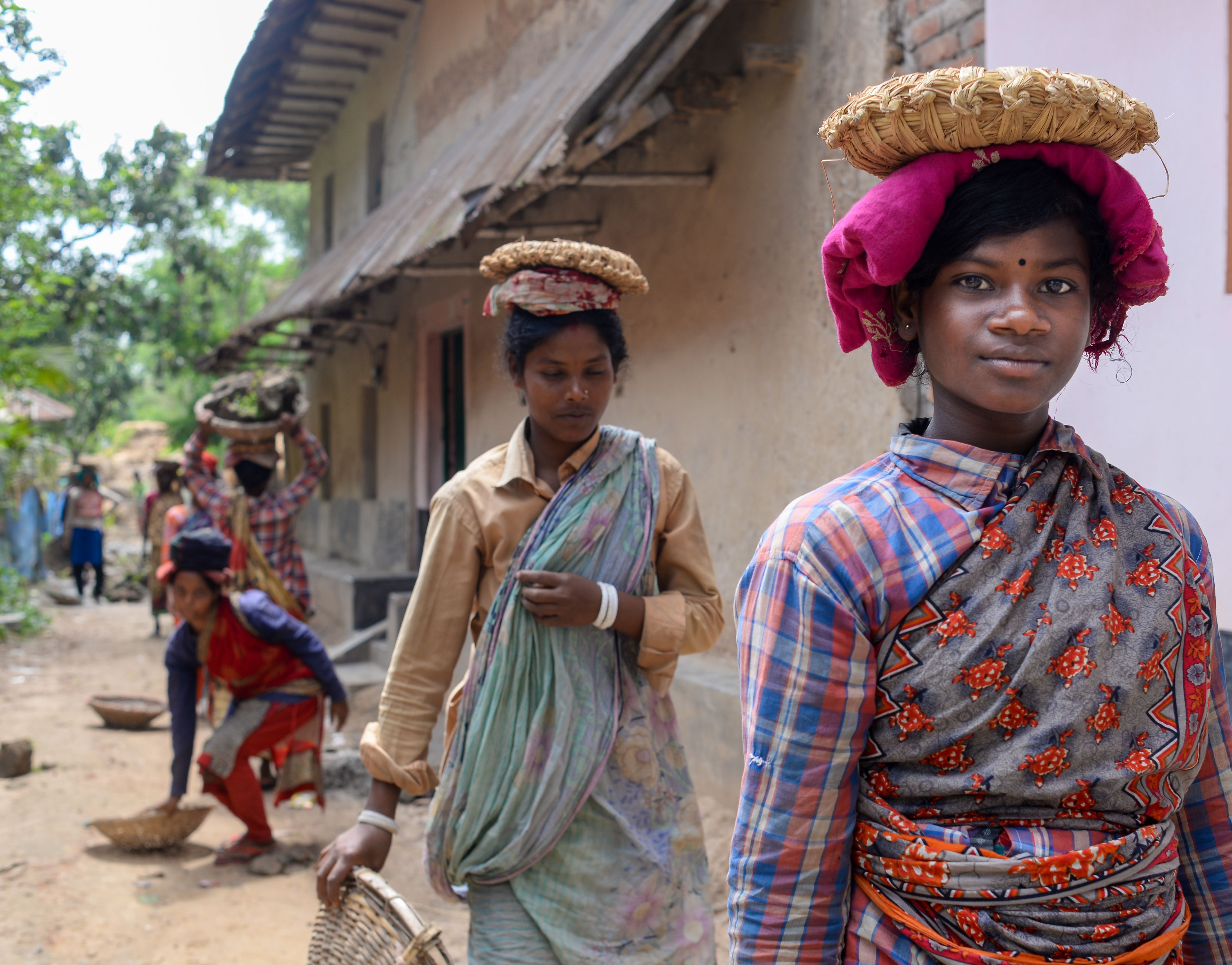 Women in Traditional Dresses Carrying Loads on Heads · Free Stock Photo