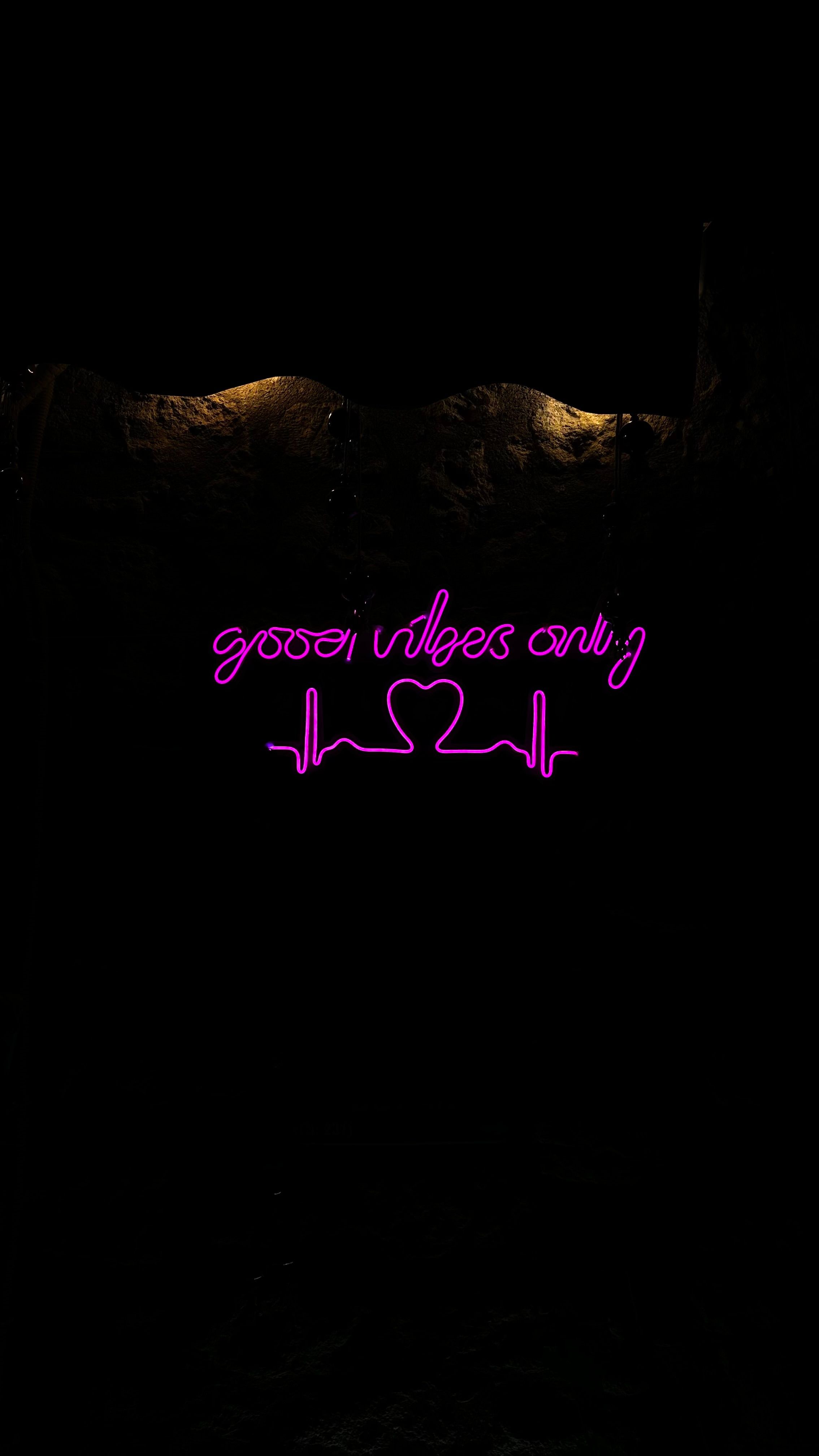 Neon Light Writing on Black Background · Free Stock Photo