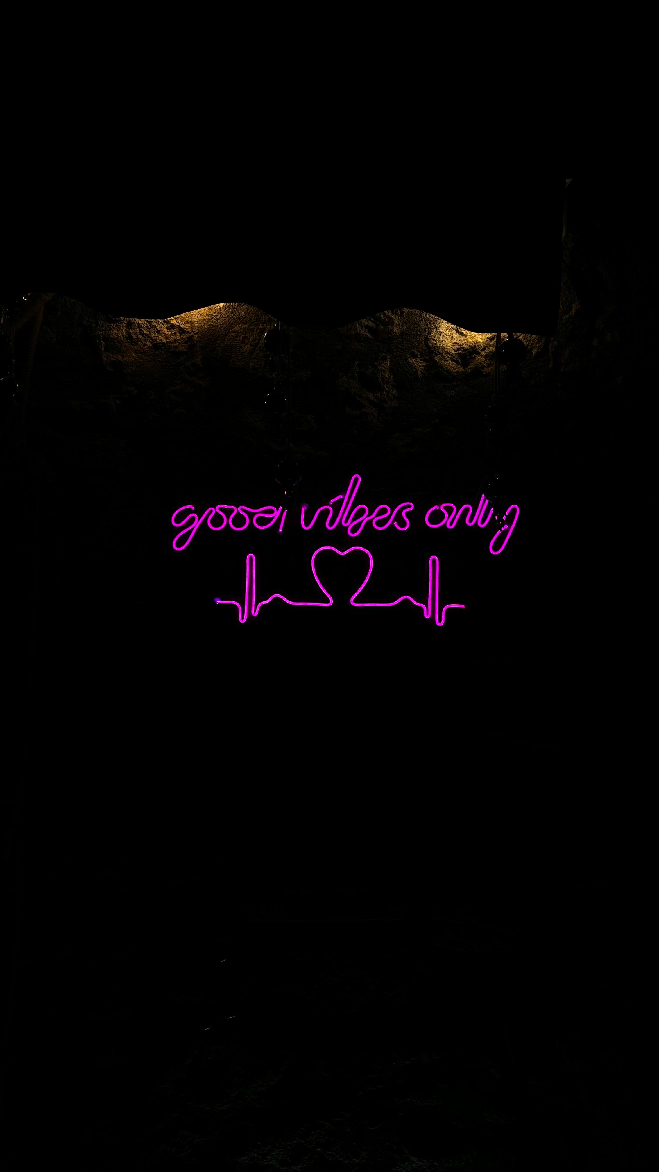 Neon Light Writing on Black Background · Free Stock Photo