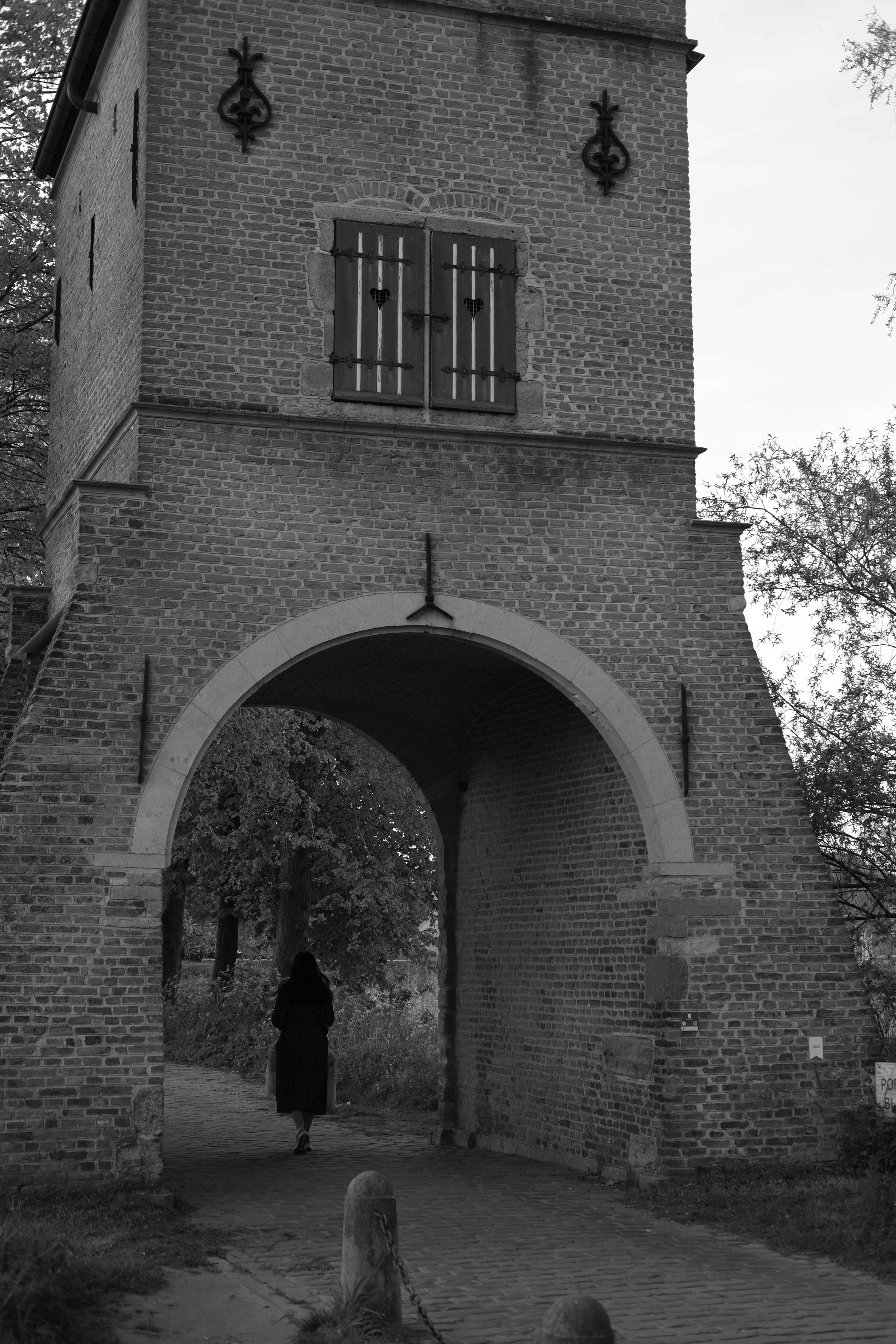 Man Standing in Front of an Arch in a Fortress · Free Stock Photo