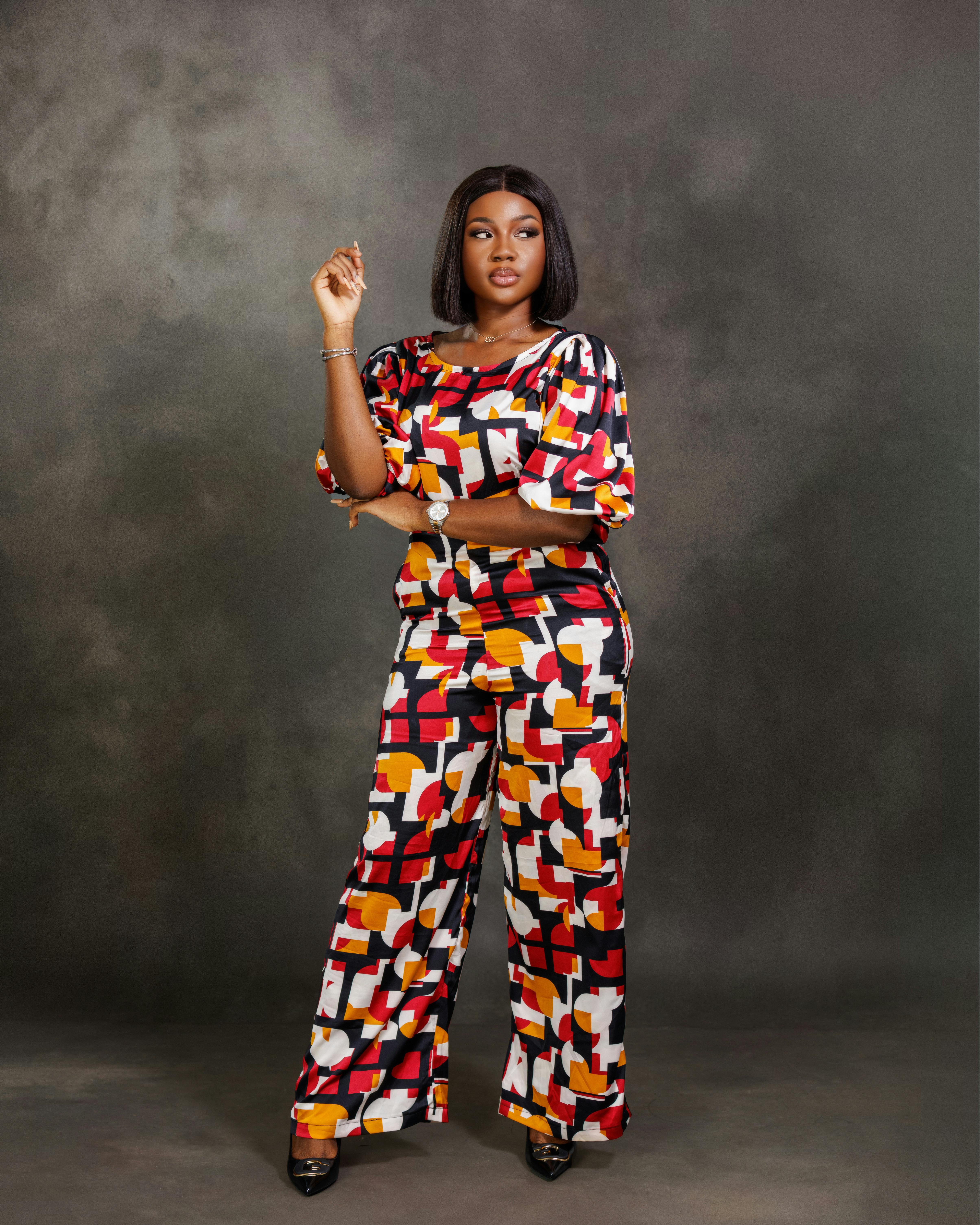 Woman Posing in Multi Colored Suit · Free Stock Photo