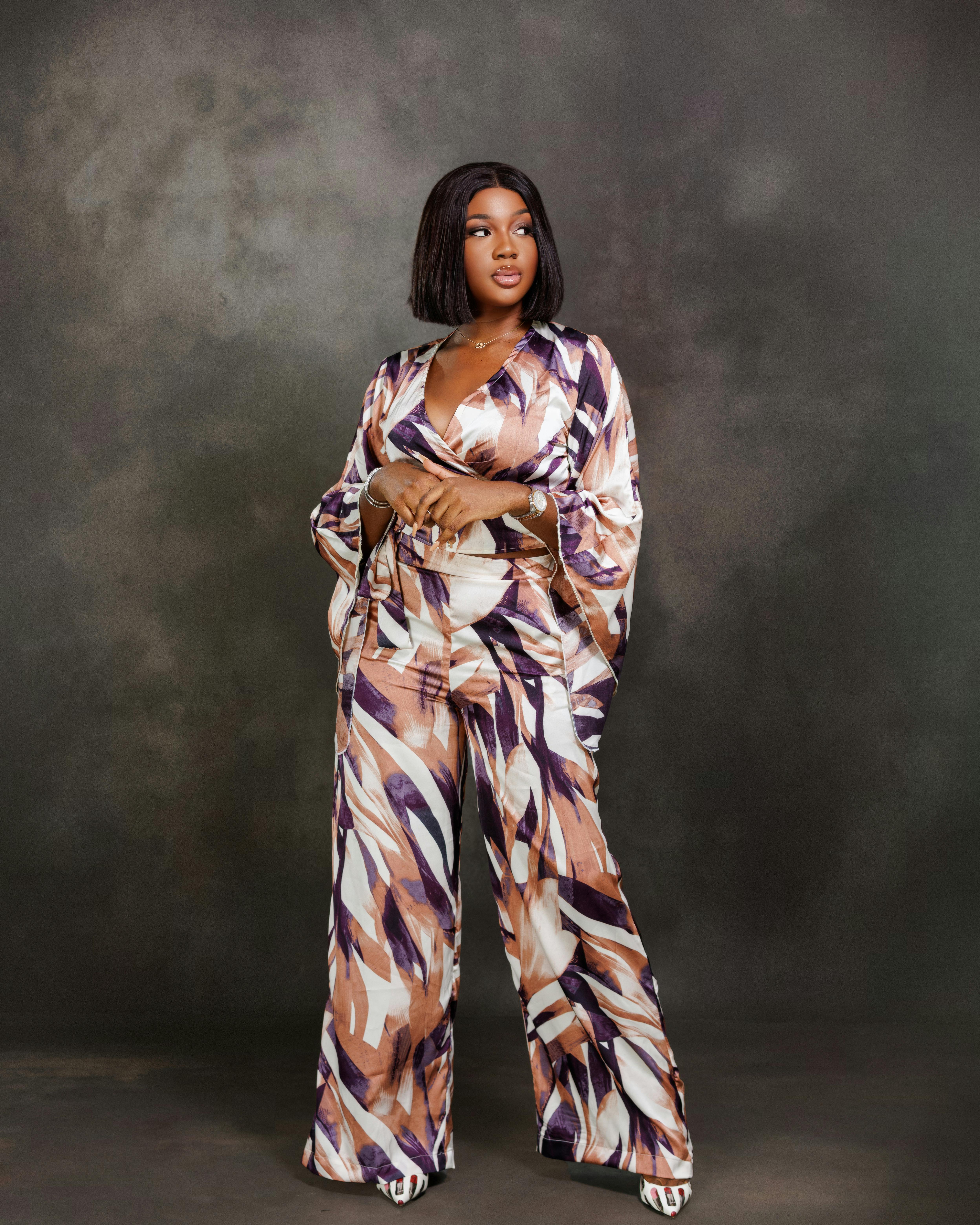 Well Dressed Woman Posing in Studio Wearing Multi Colored Suit · Free ...