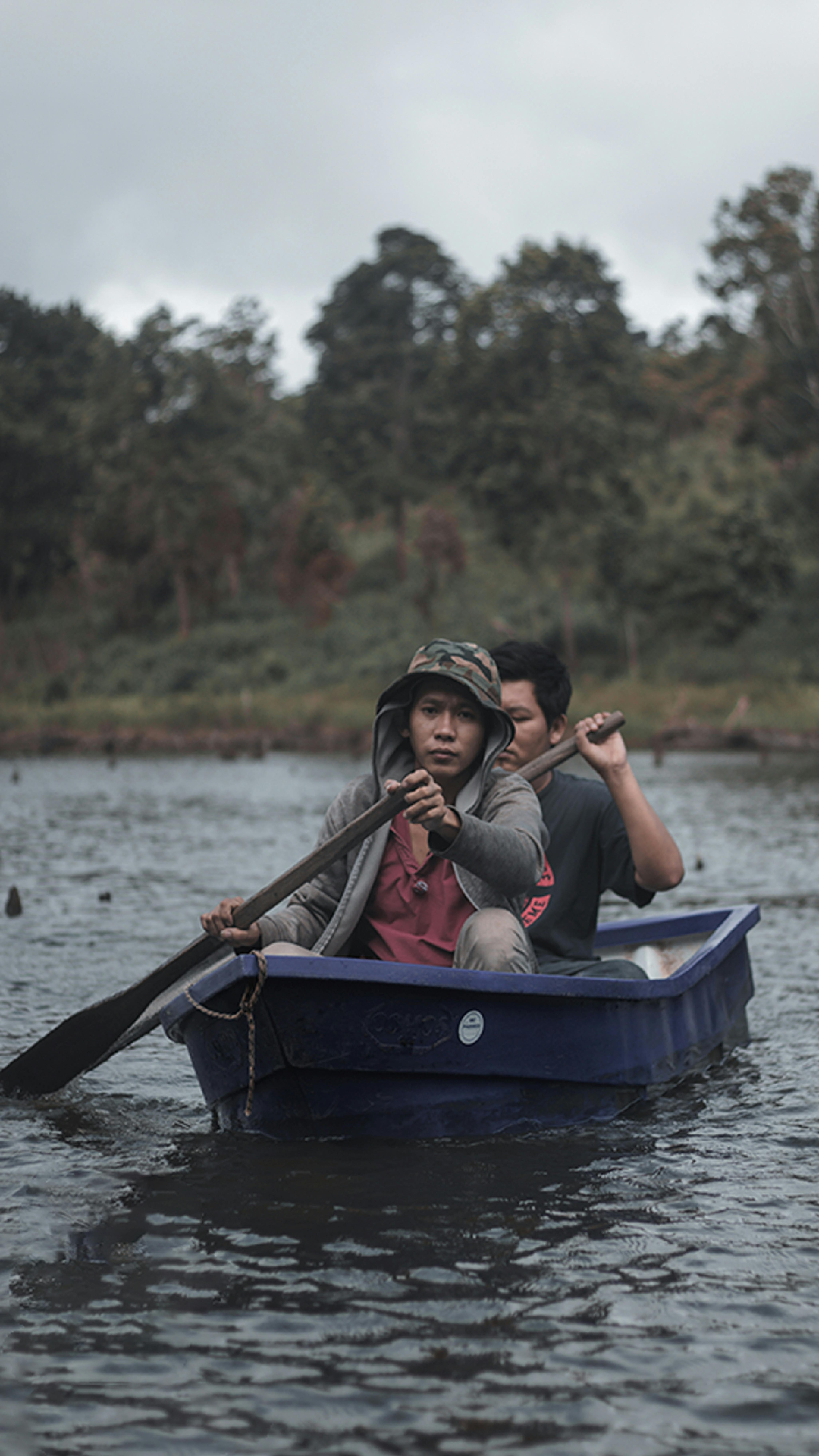 Group of People Ride on Jon Boats Near Bridge · Free Stock Photo