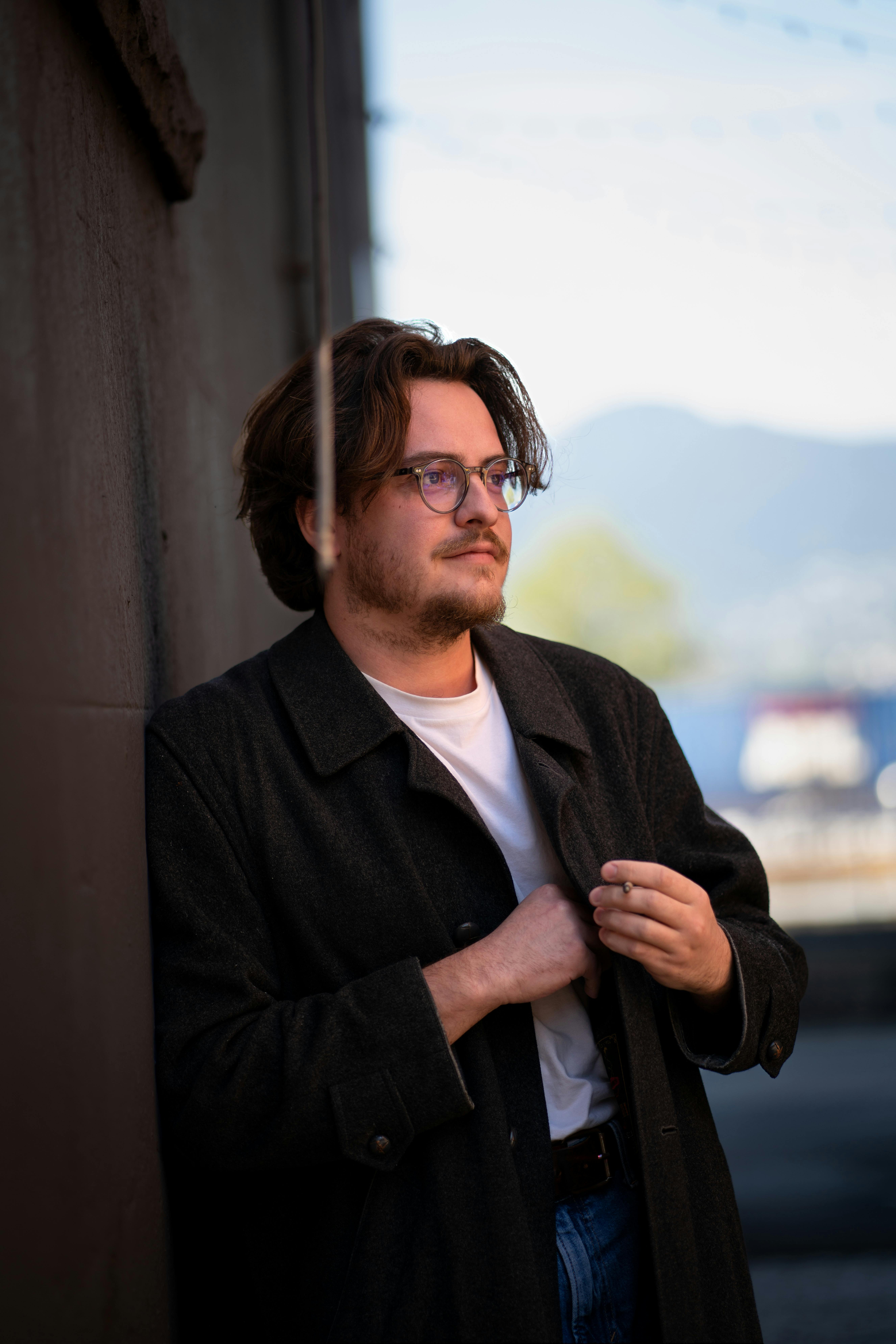 Man Posing by Pepsi Logo on Wall · Free Stock Photo