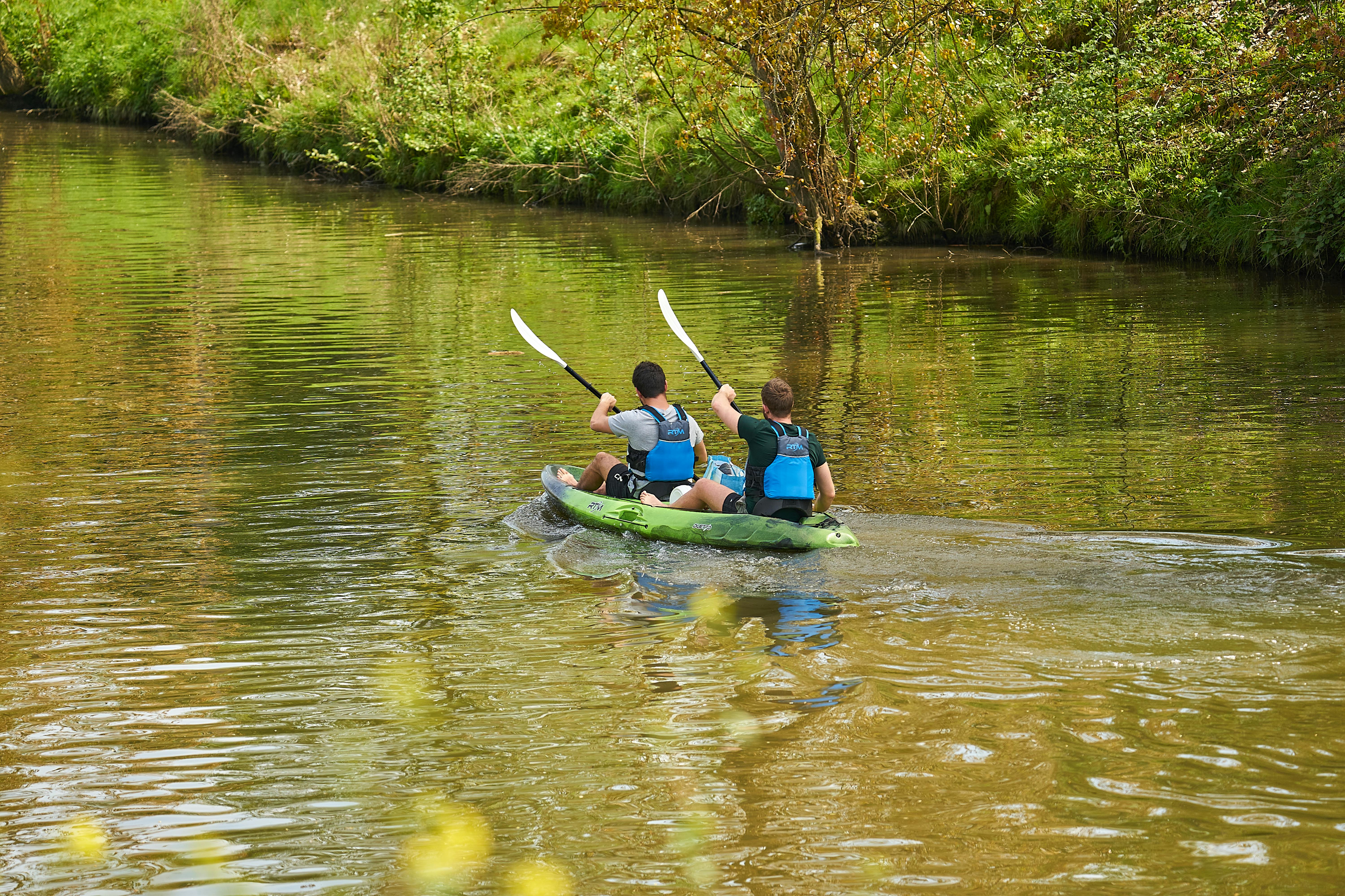 Rowers in a Kayak on the River · Free Stock Photo