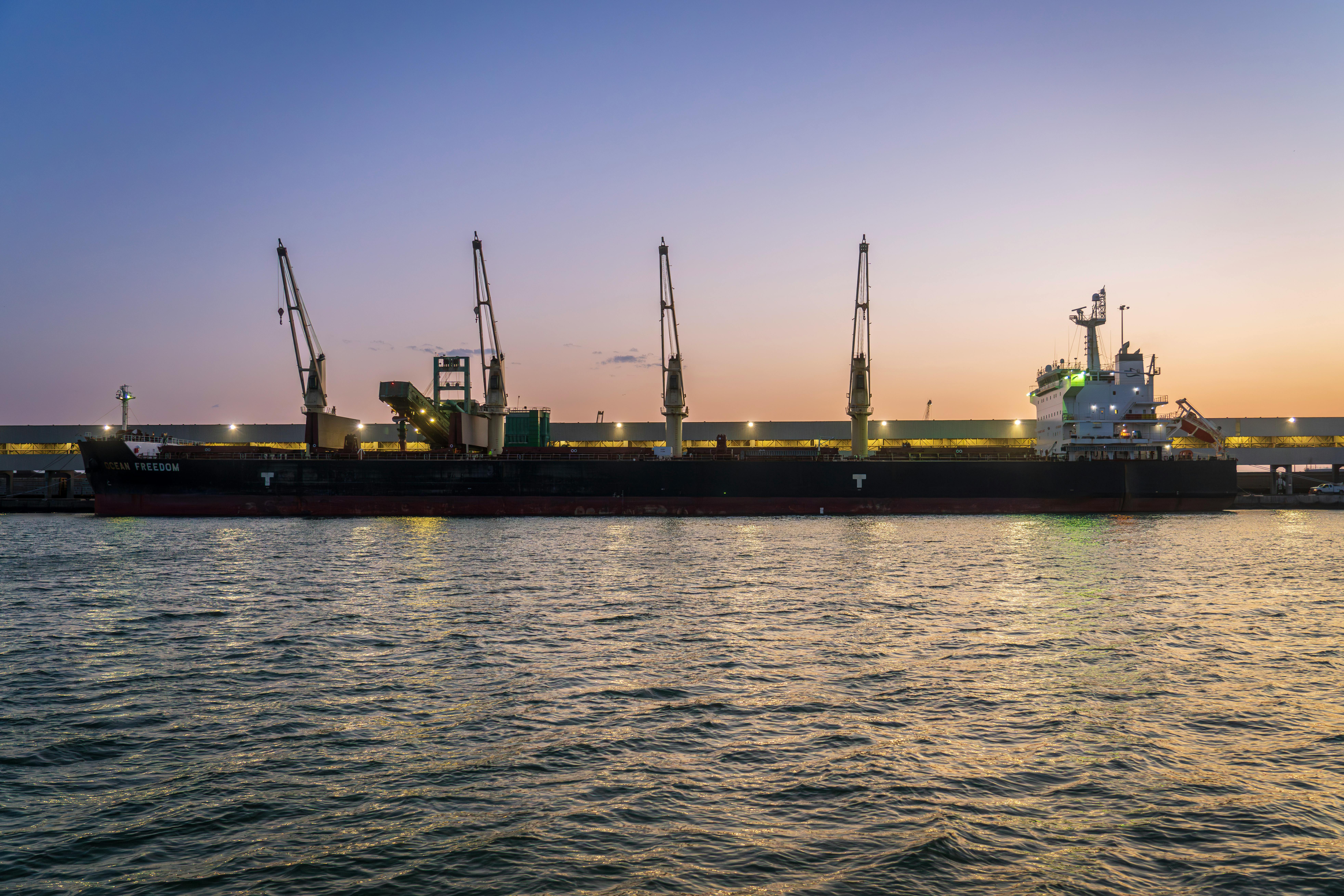 Cargo Ship Docked in Port in Dusk · Free Stock Photo