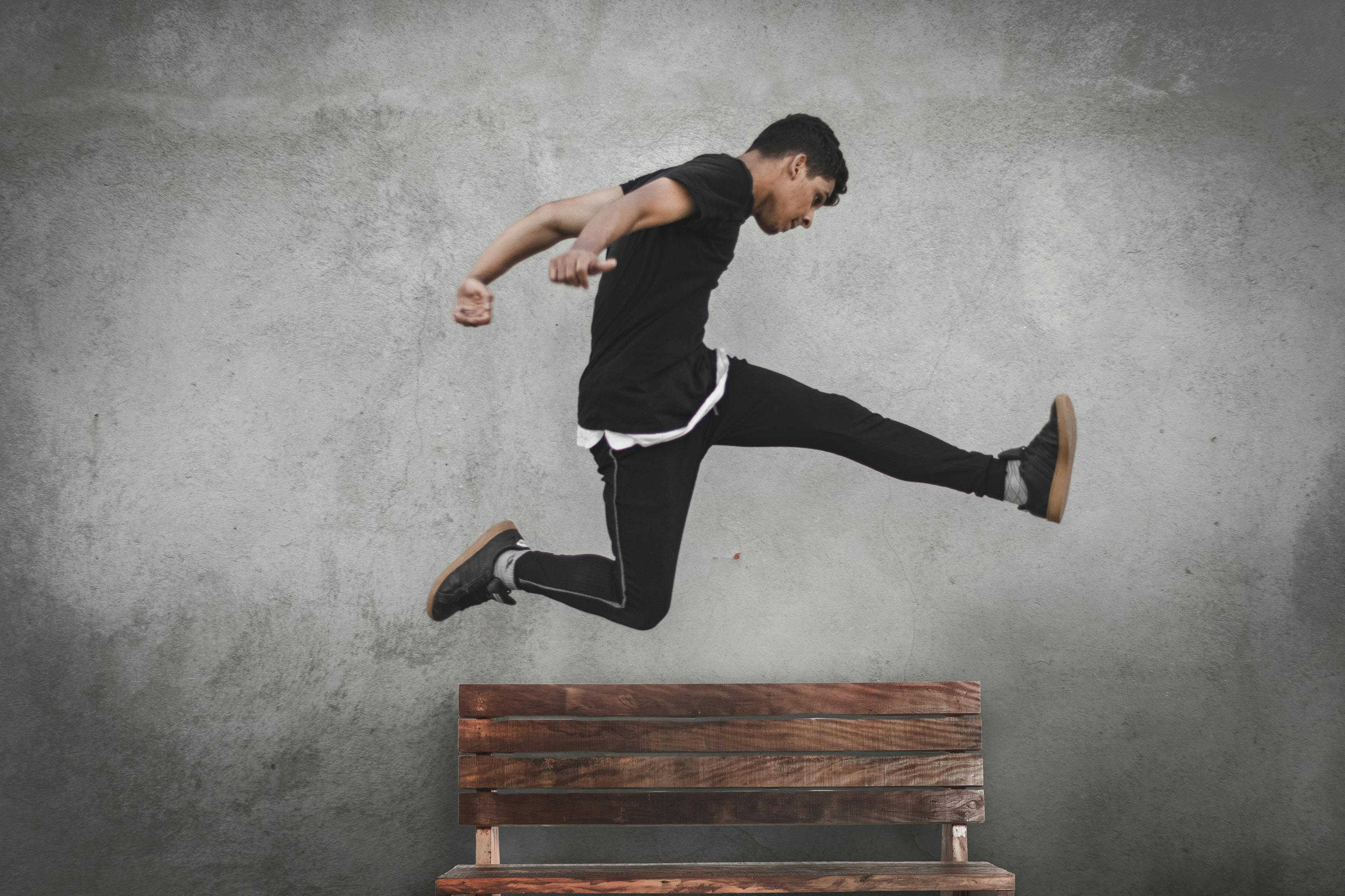 Man Jumping over Bench · Free Stock Photo