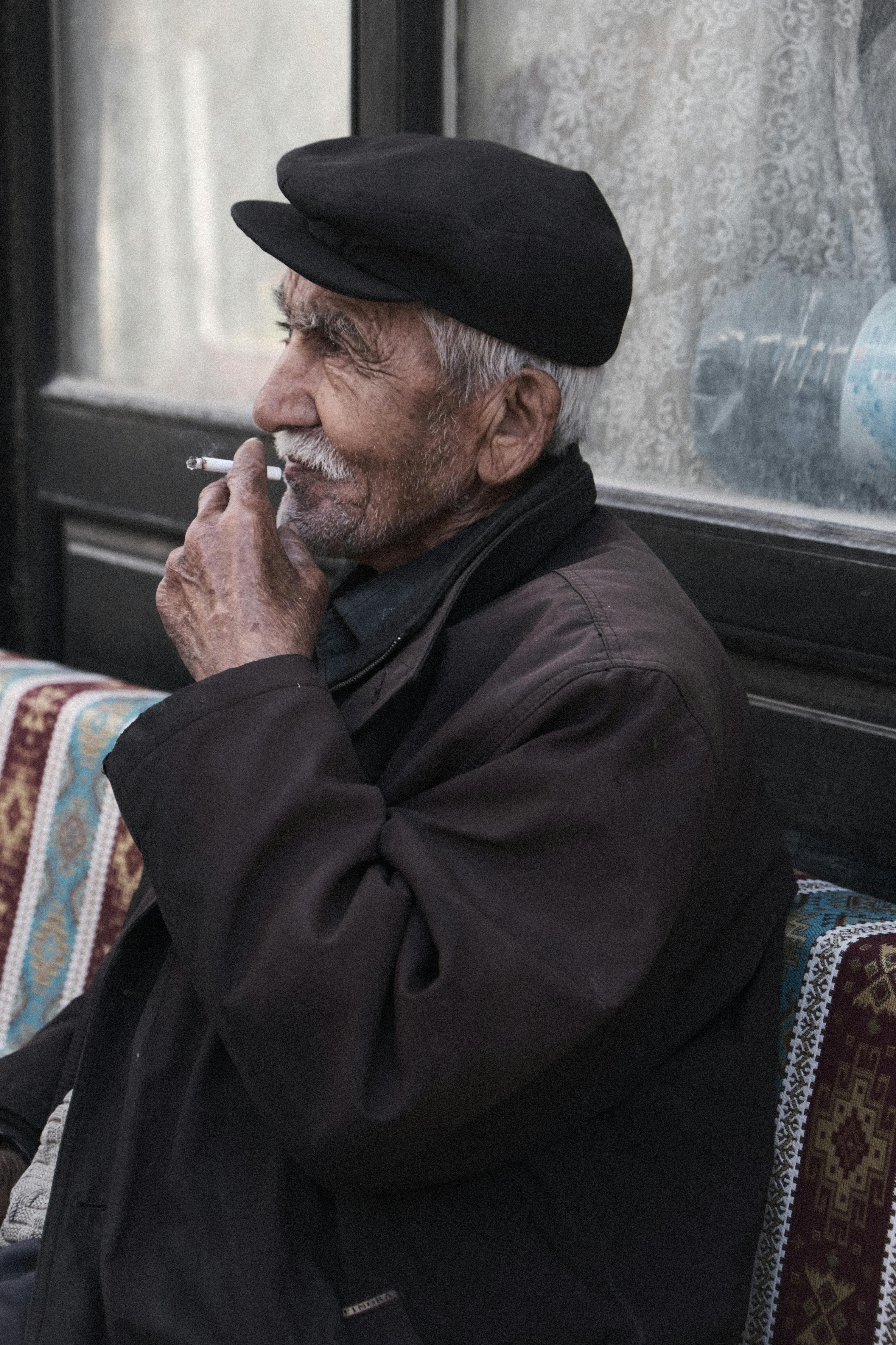 Elderly Man Smoking Cigarette · Free Stock Photo
