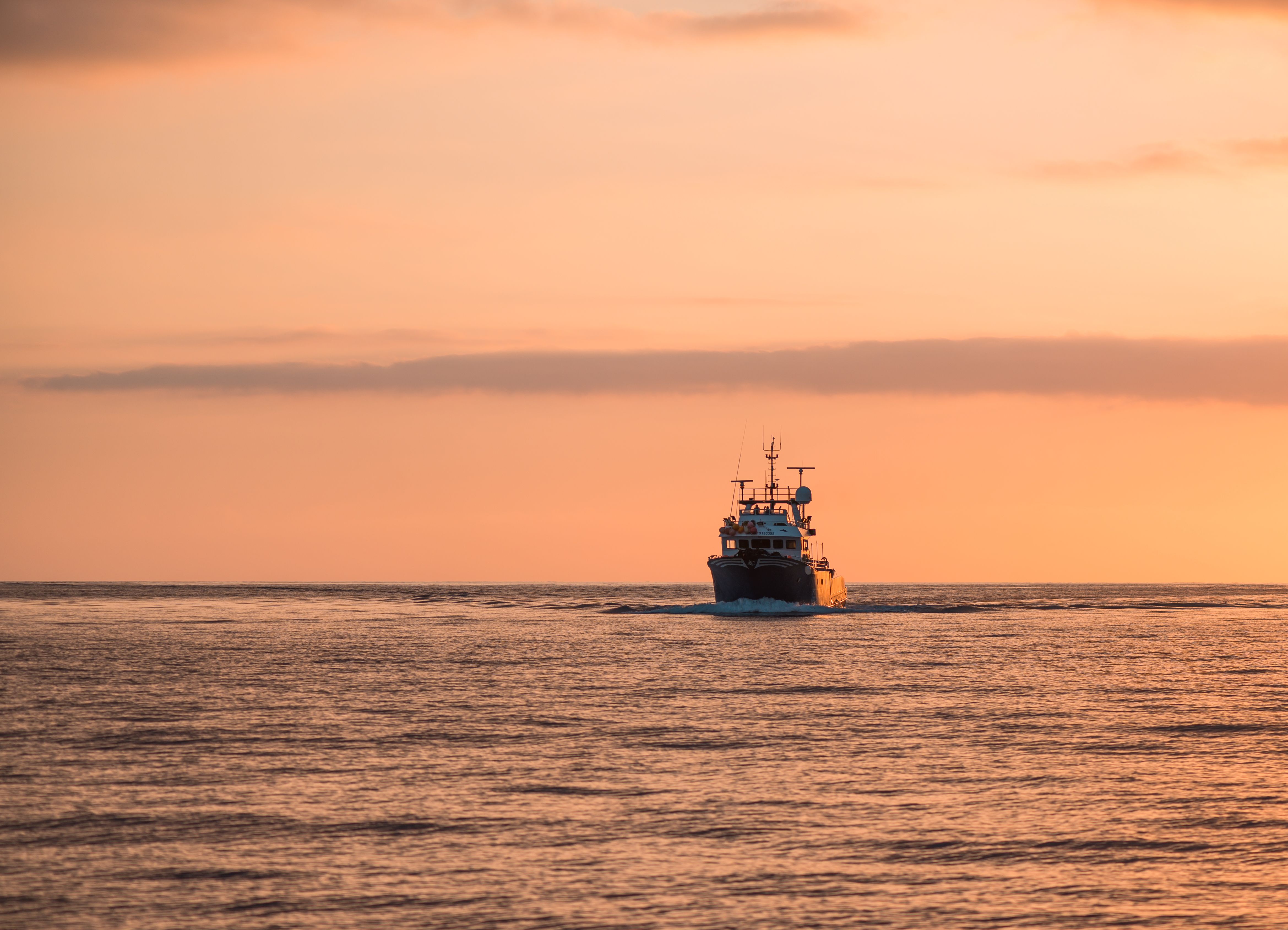 Ship Sailing on Sea at Sunset · Free Stock Photo