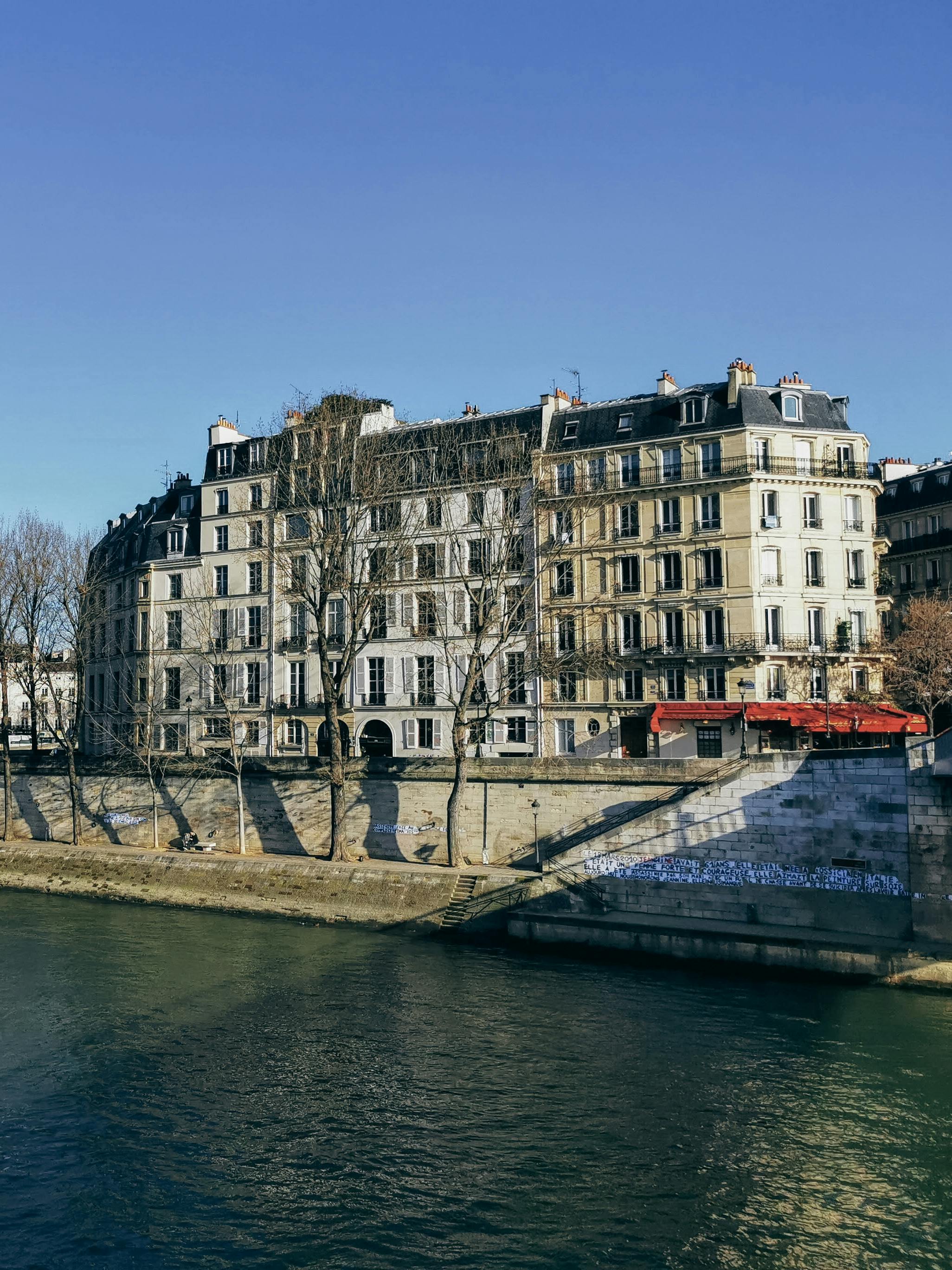 Traditional Waterfront Tenement House by the River Seine in Paris ...