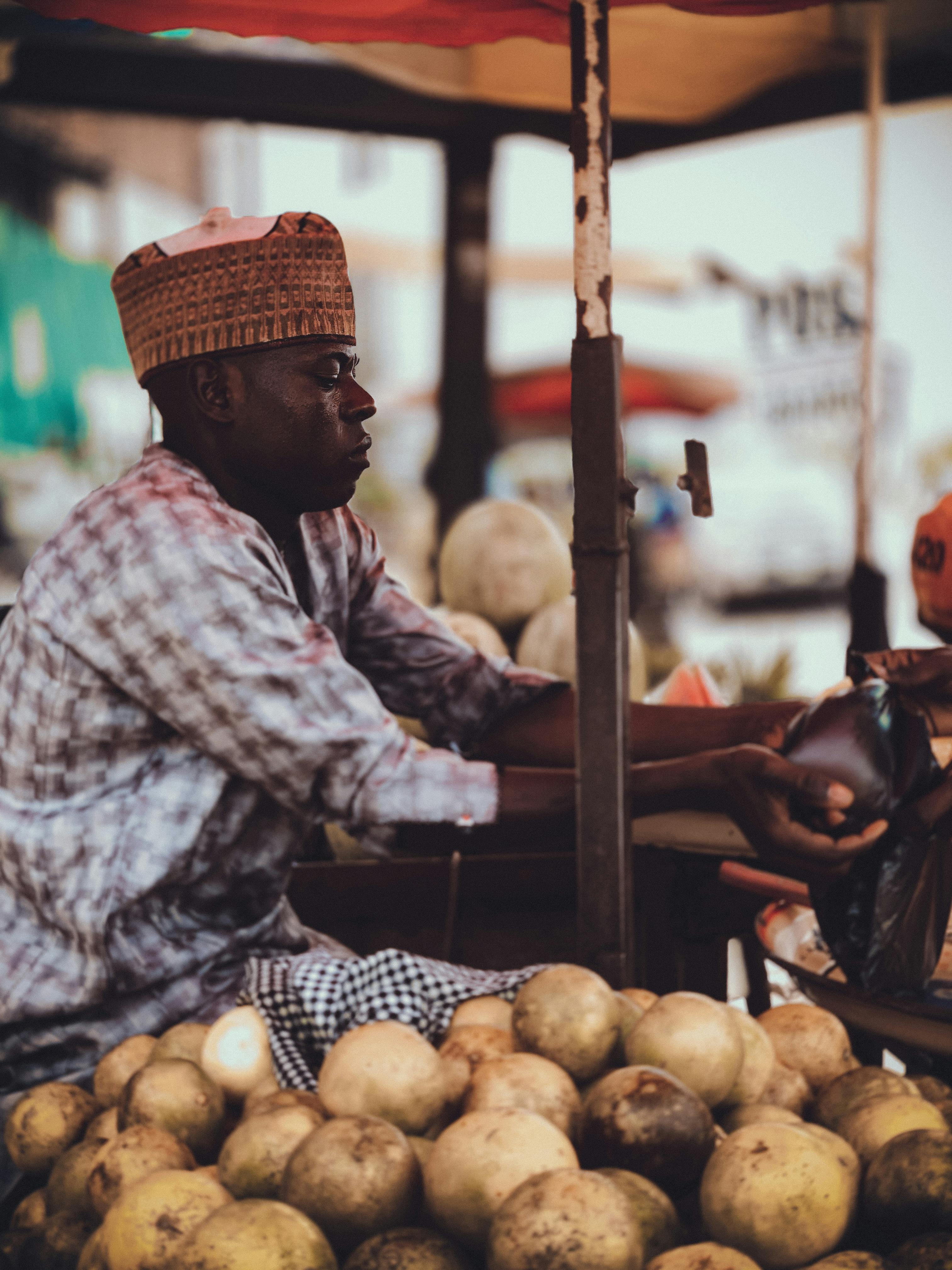 Photo of a Man Selling Vegetables · Free Stock Photo