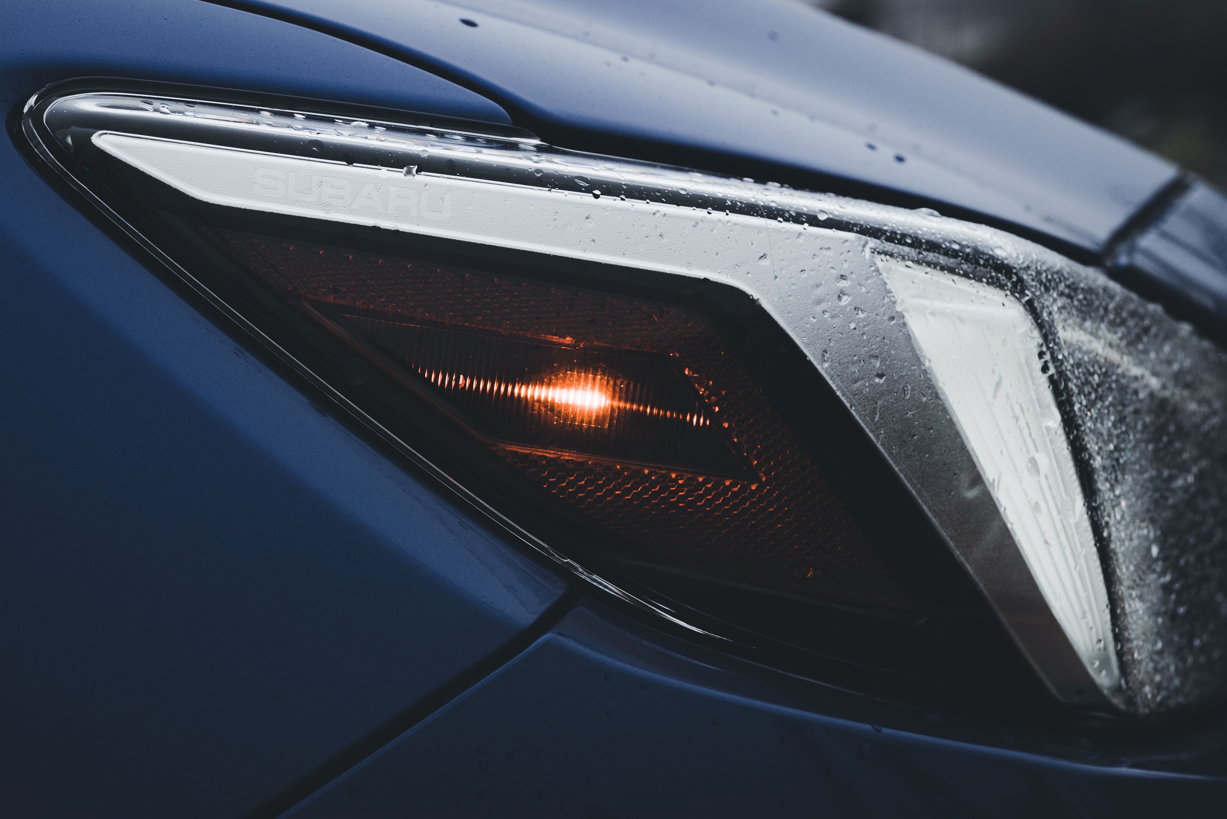 Close-up of the Headlight in a Blue Subaru WRX · Free Stock Photo