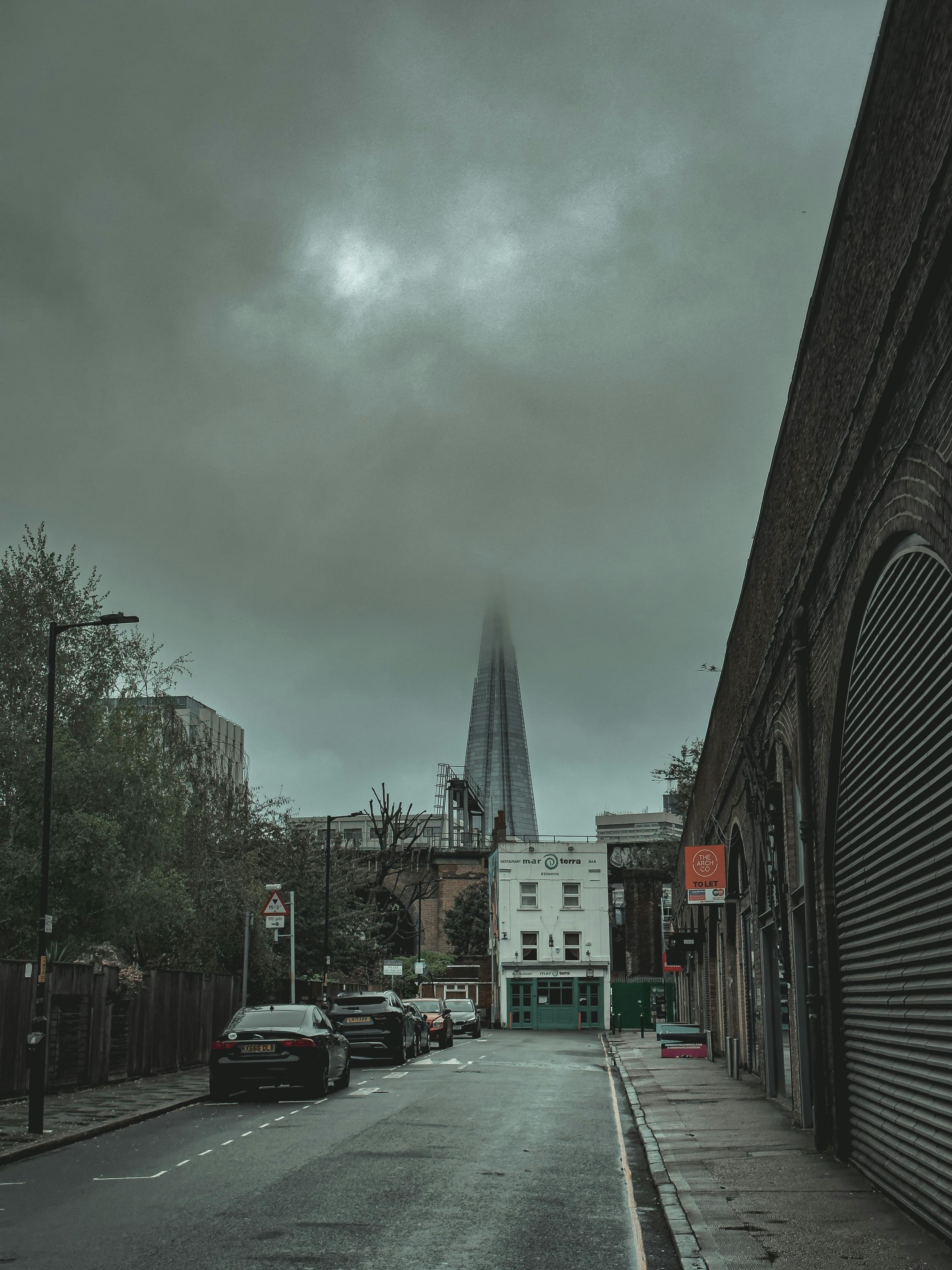 Rain Cloud over Building in Town · Free Stock Photo