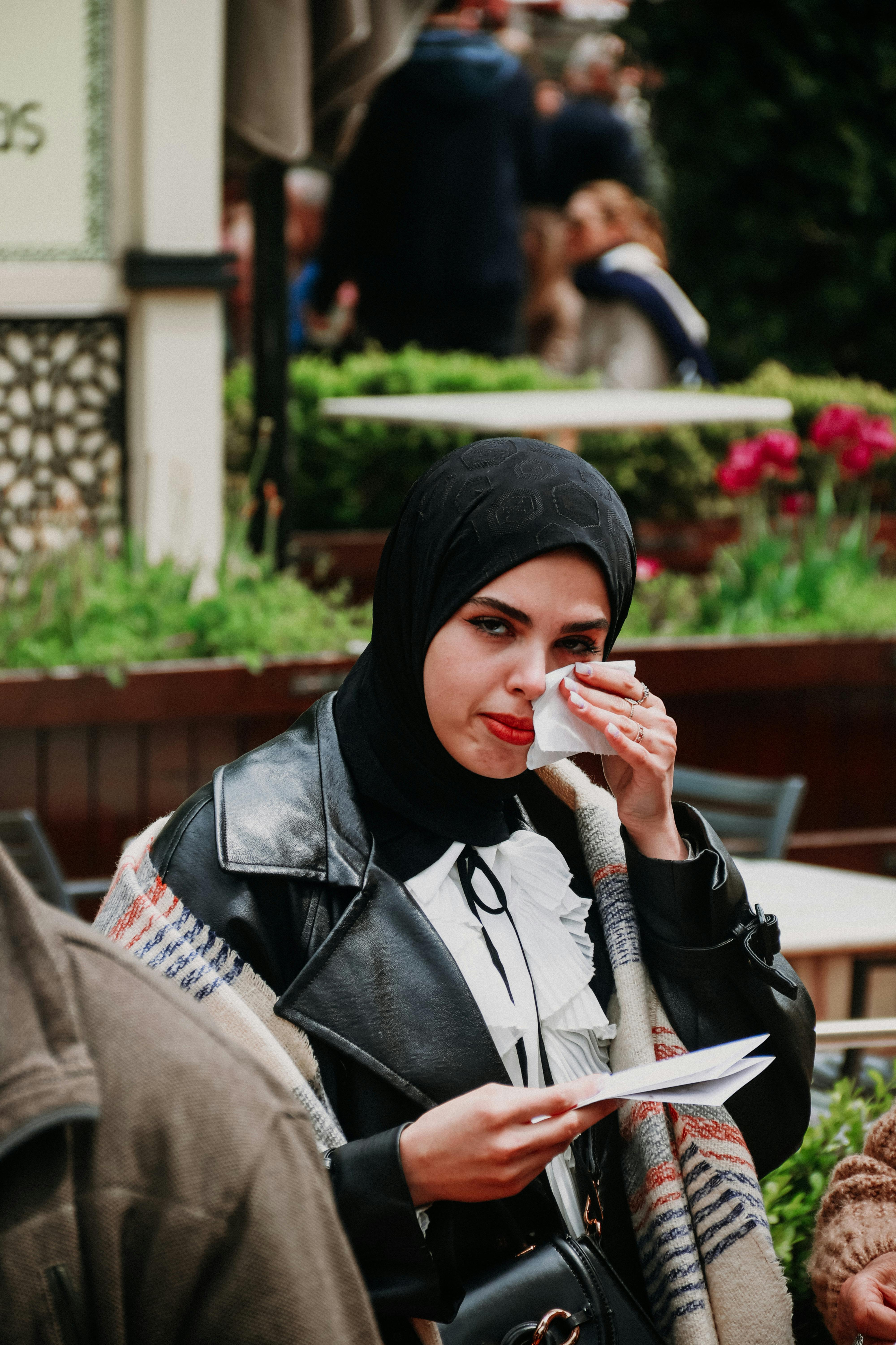 Young Woman Wiping Her Face with a Tissue · Free Stock Photo