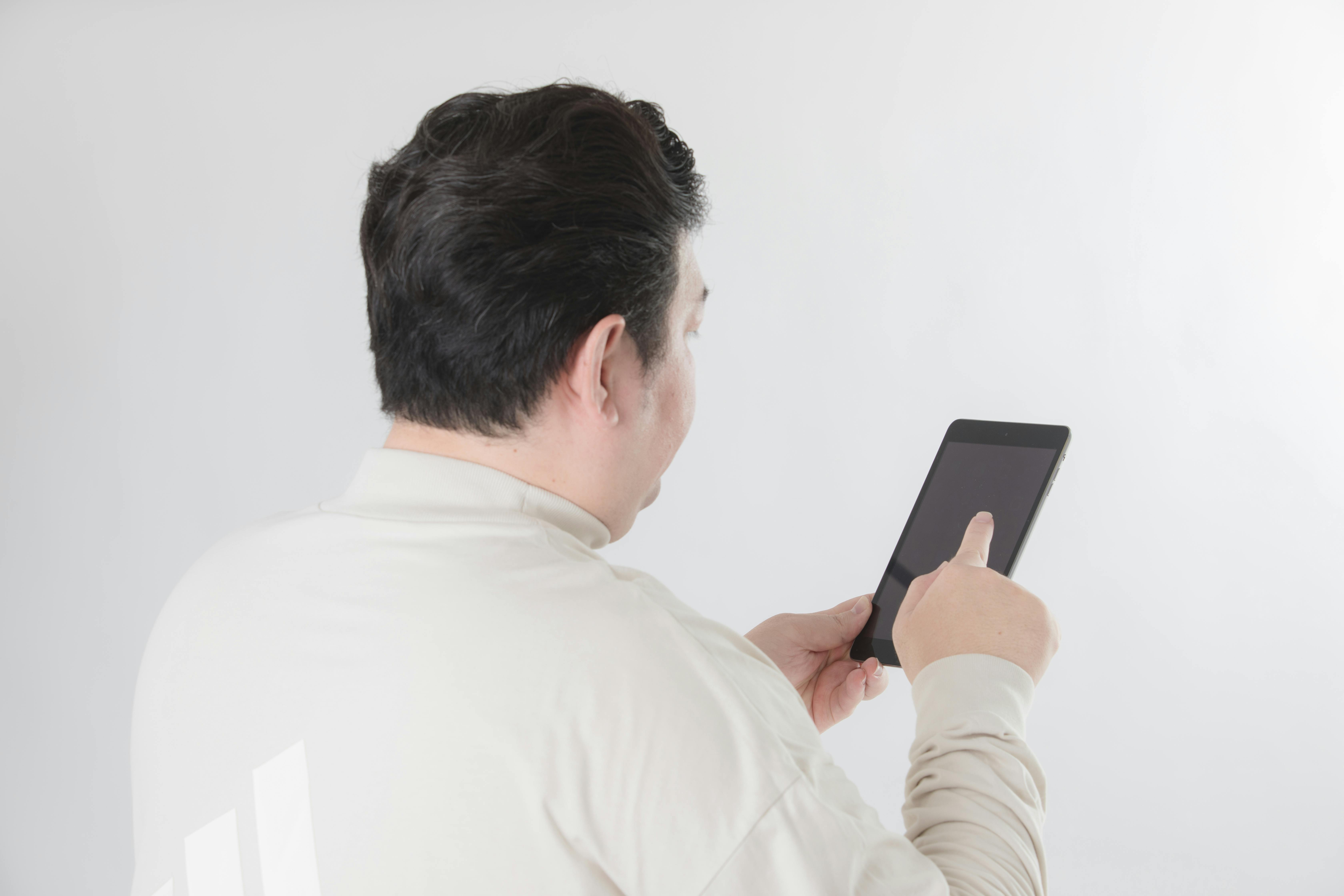 Back View of Man with Tablet · Free Stock Photo
