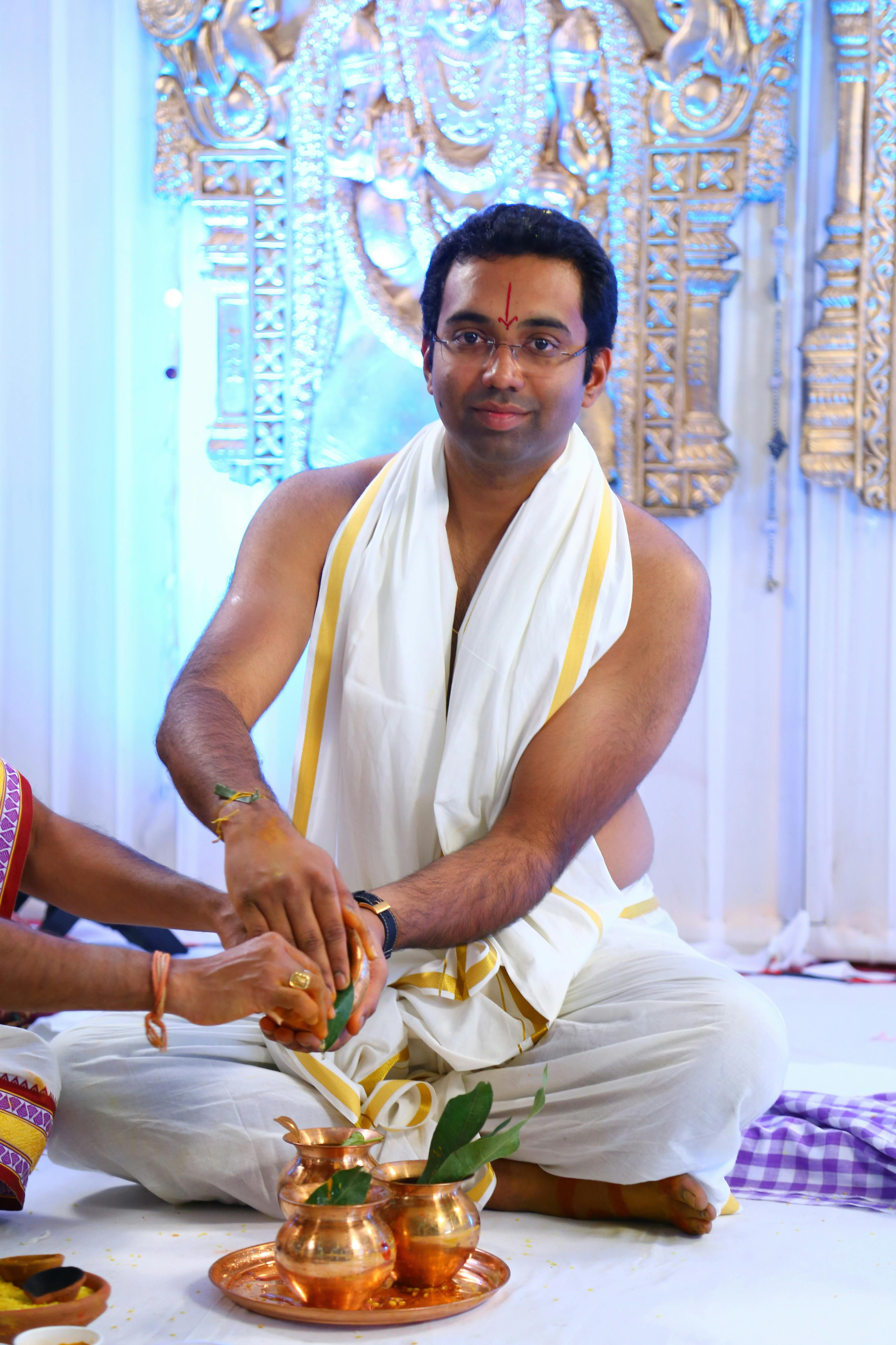 Three People Doing a Traditional Celebration · Free Stock Photo
