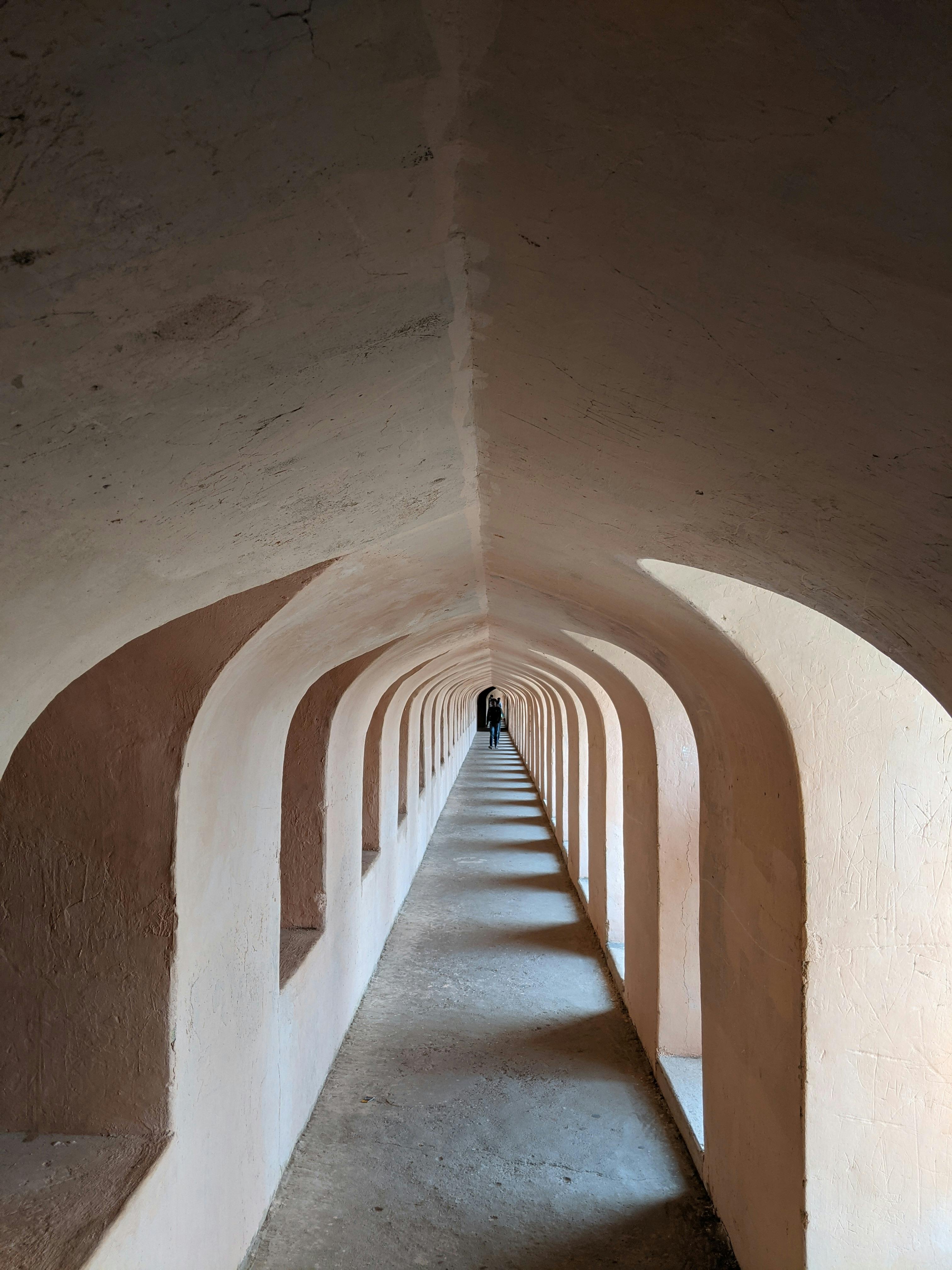 Long Arcade with Arched Columns · Free Stock Photo