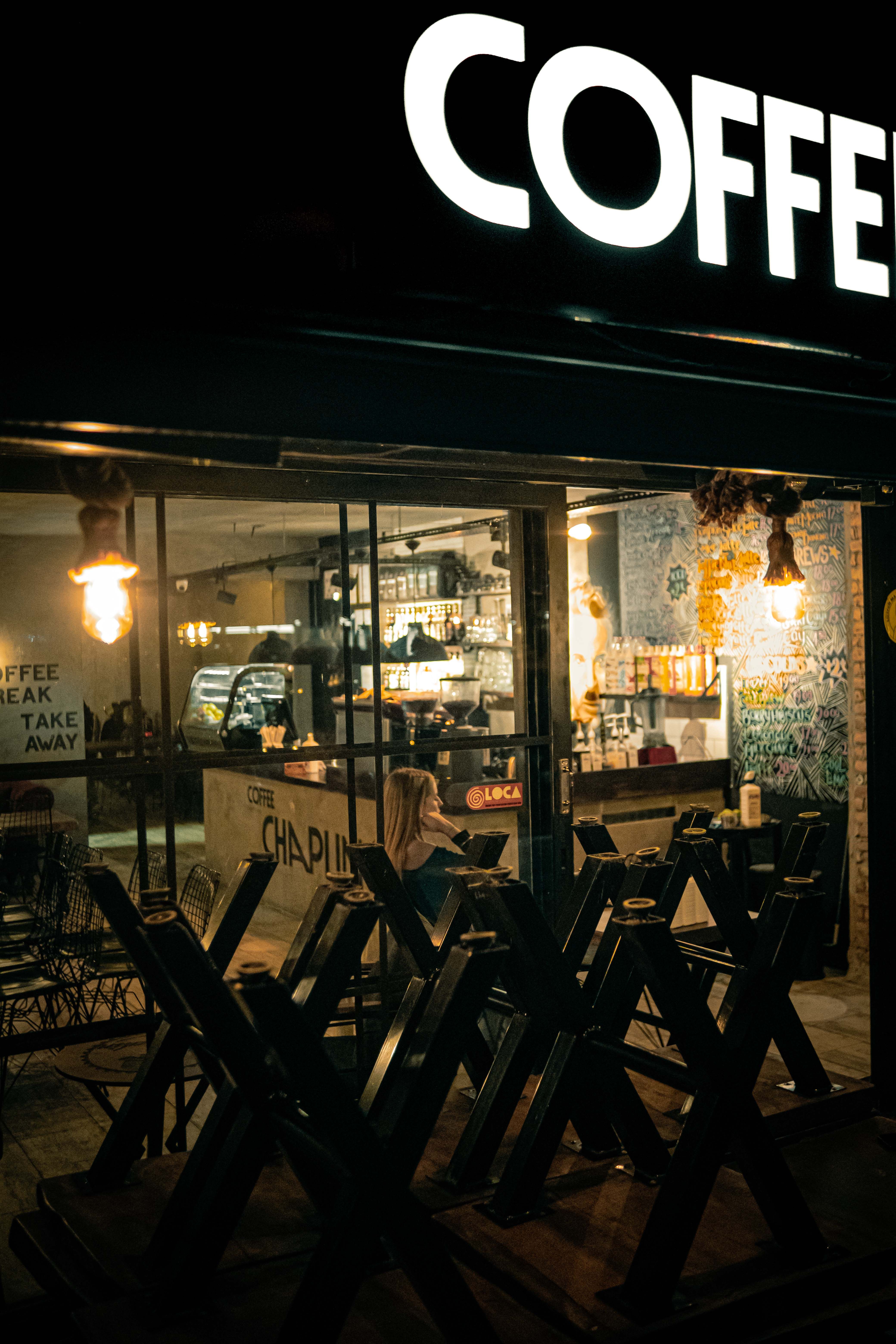 A Low Ange Shot of a Starbucks Building at Night · Free Stock Photo