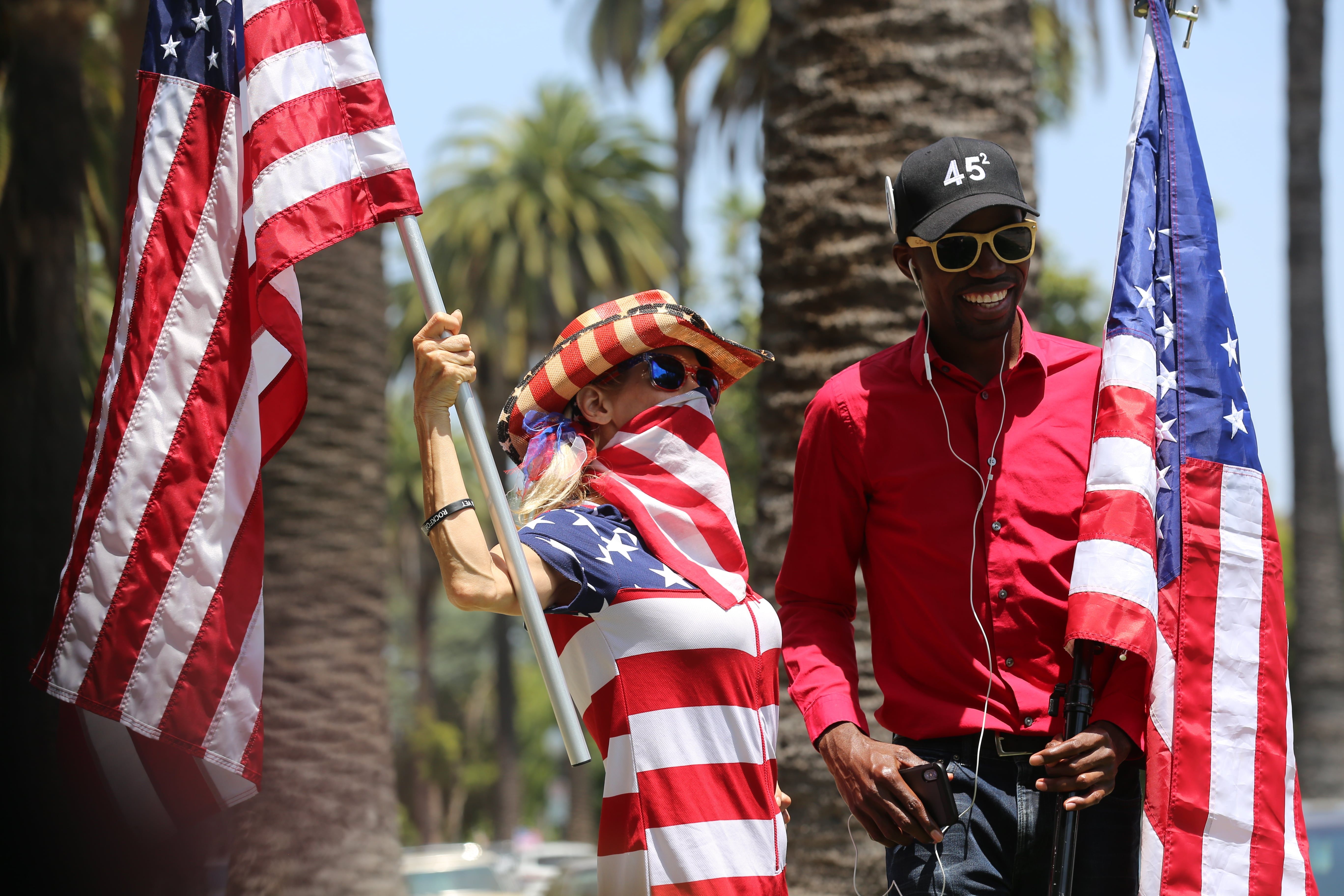 Crop person holding American flag in wind · Free Stock Photo