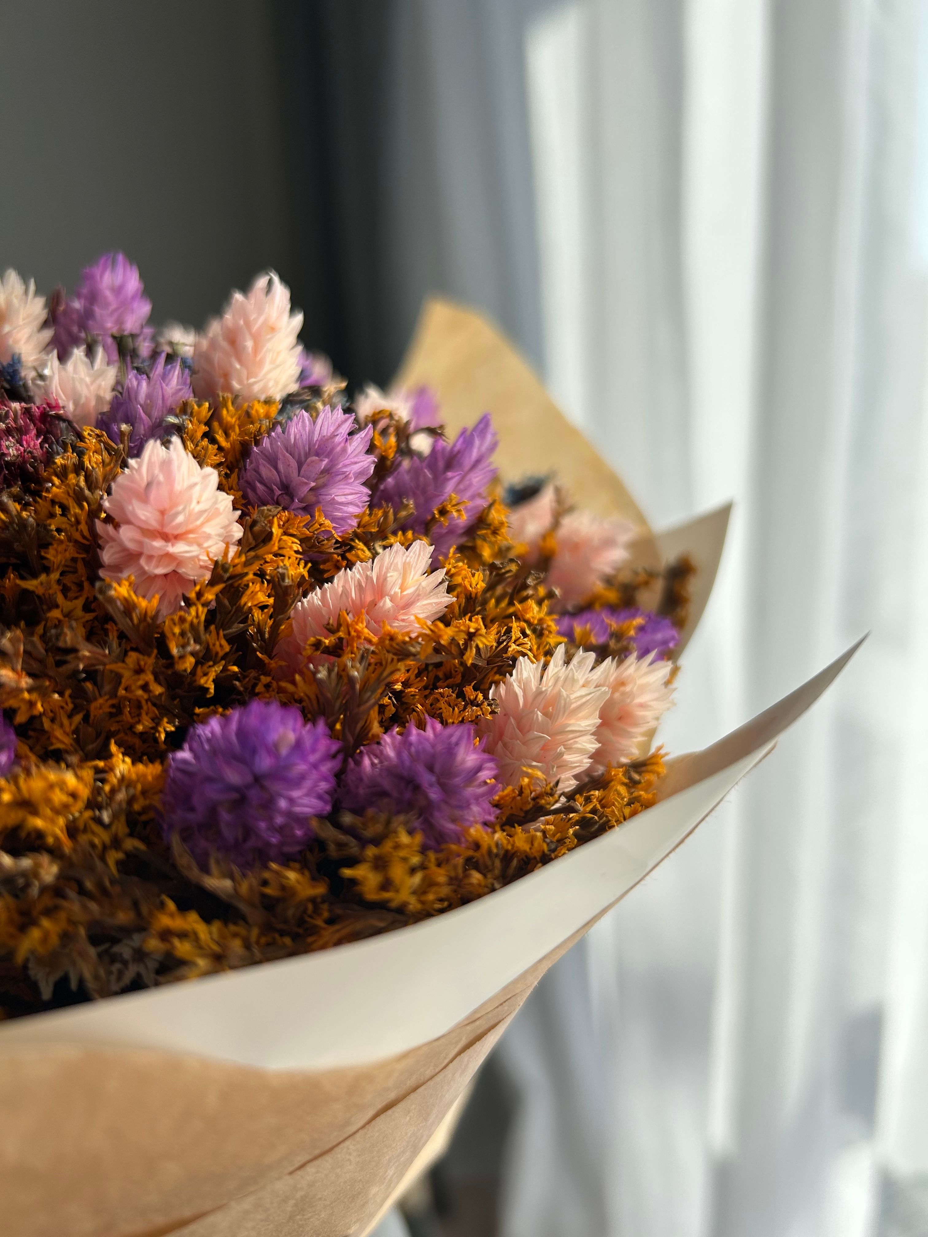 Bunch of Flowers Left Near Barred Window · Free Stock Photo