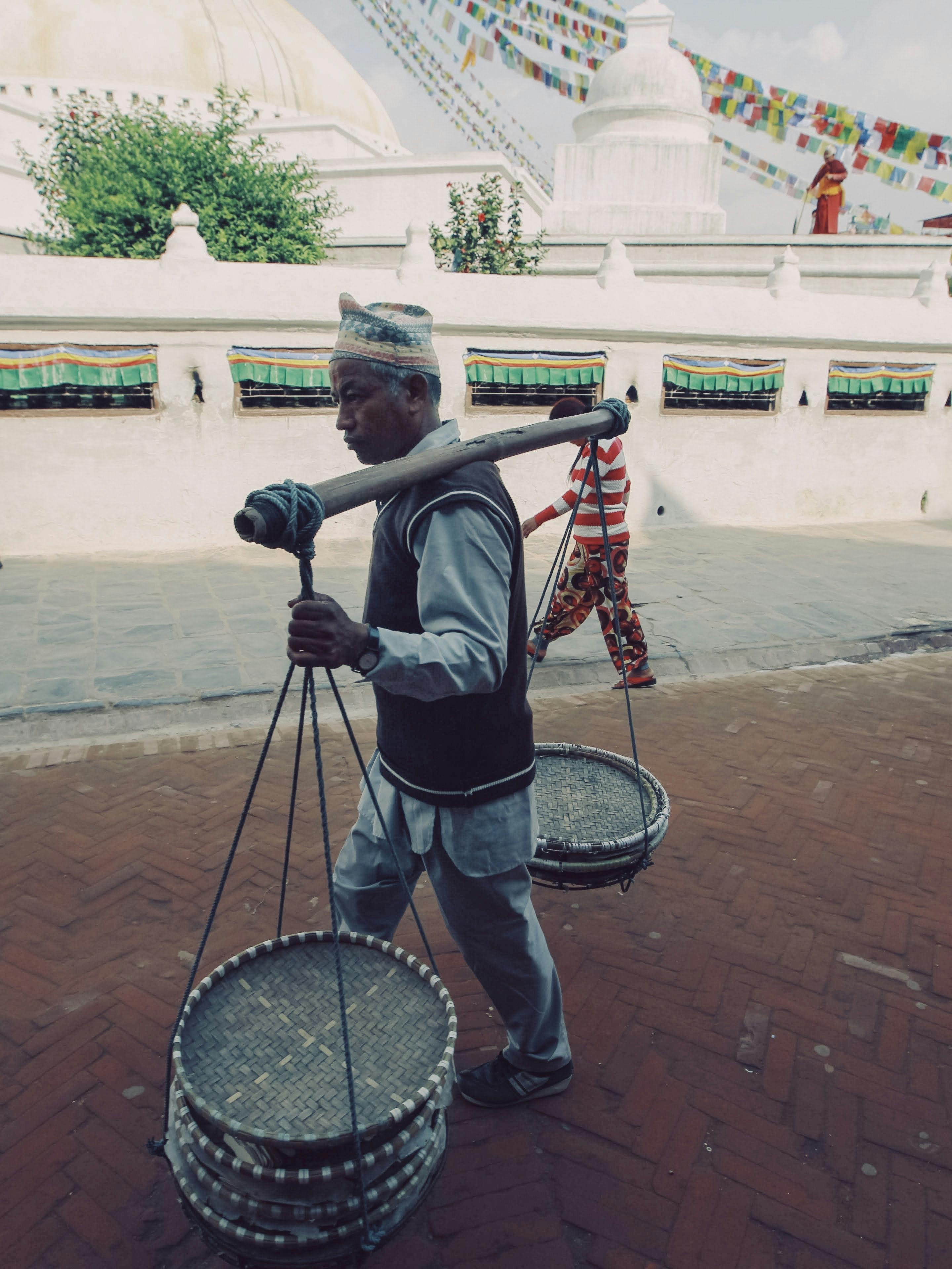 Man Carrying Plates in Town · Free Stock Photo