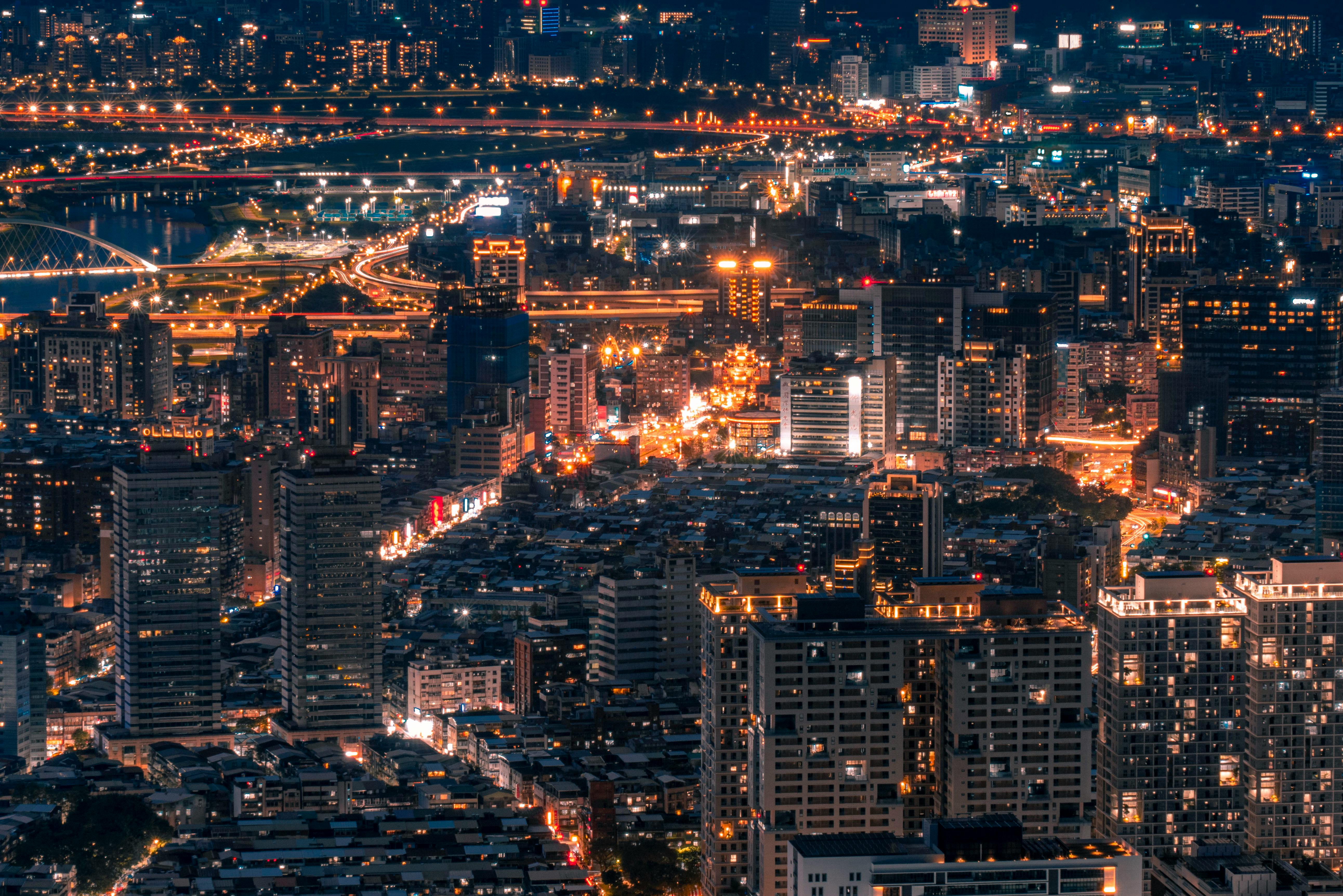 Aerial View of a Modern Illuminated City at Night · Free Stock Photo