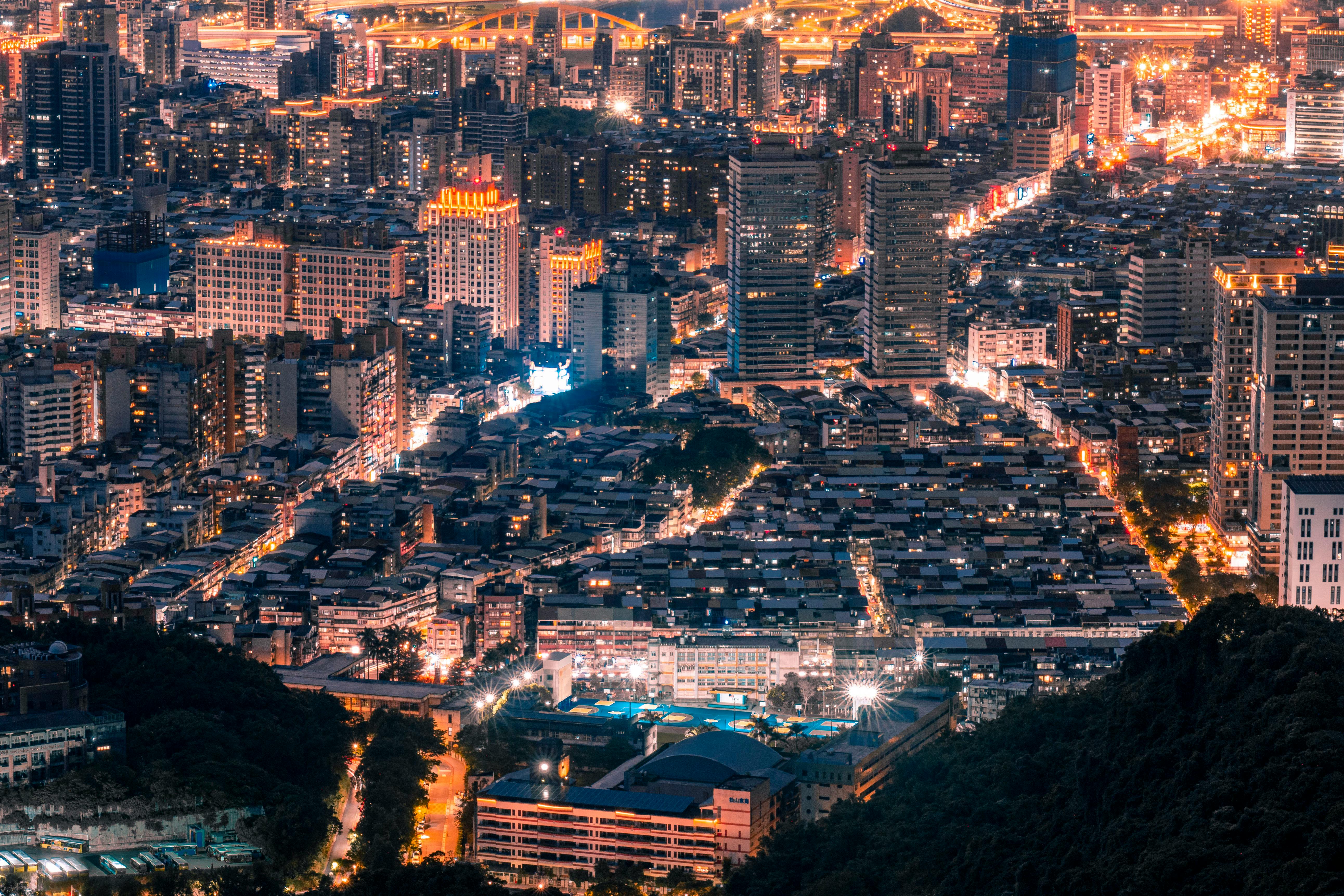 Aerial View of a Modern Illuminated City at Night · Free Stock Photo